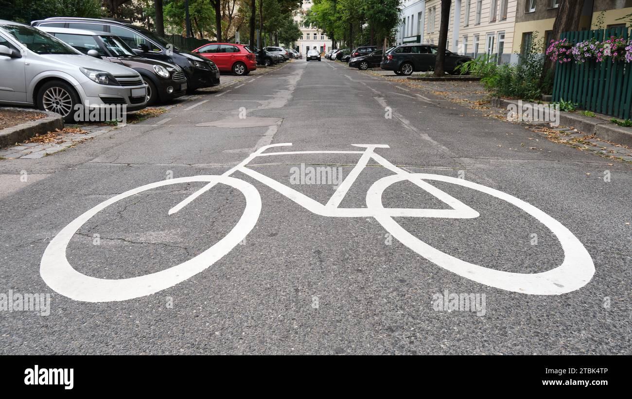 Big white bicycle sign on ground at residential street, concept for ...