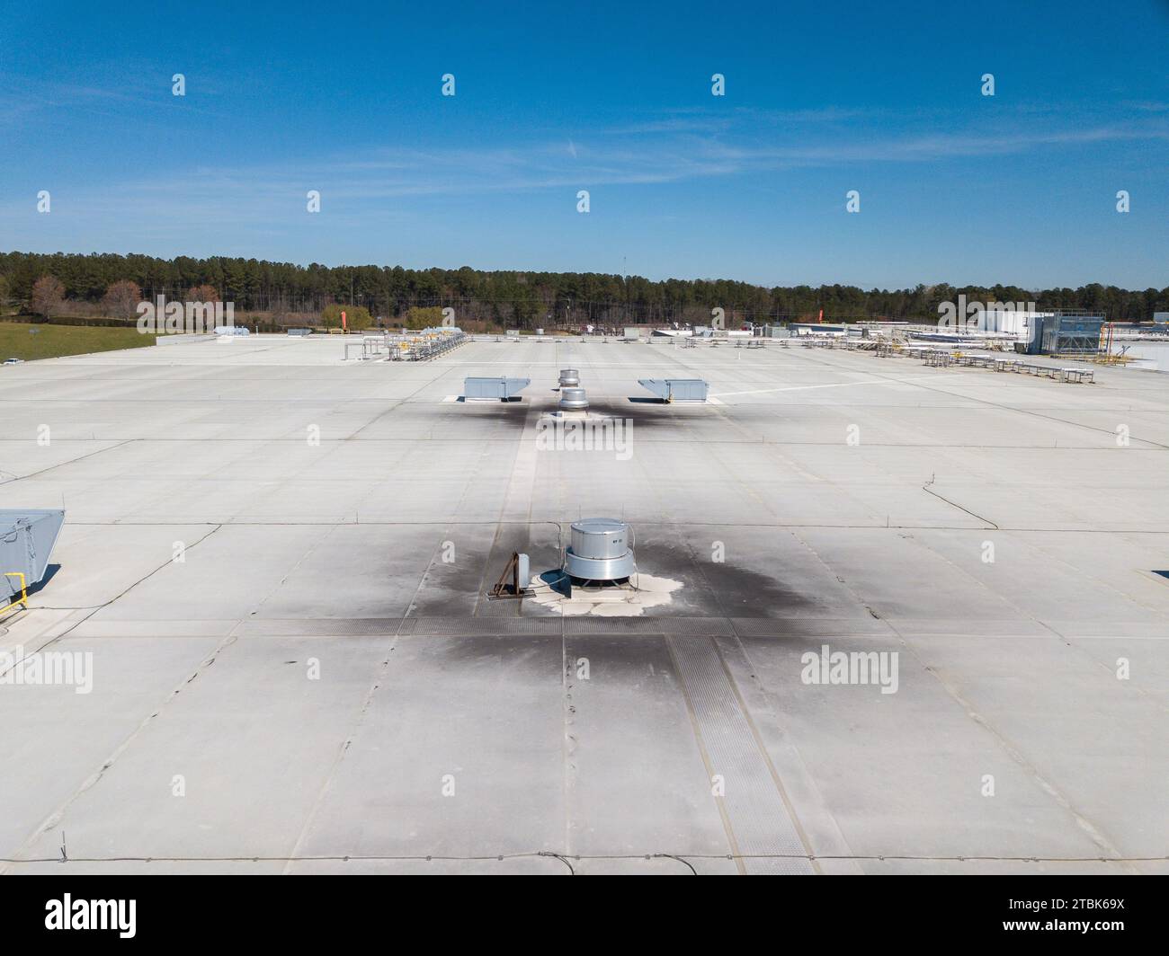Drone images of the roof of a food distribution warehouse, and a ...