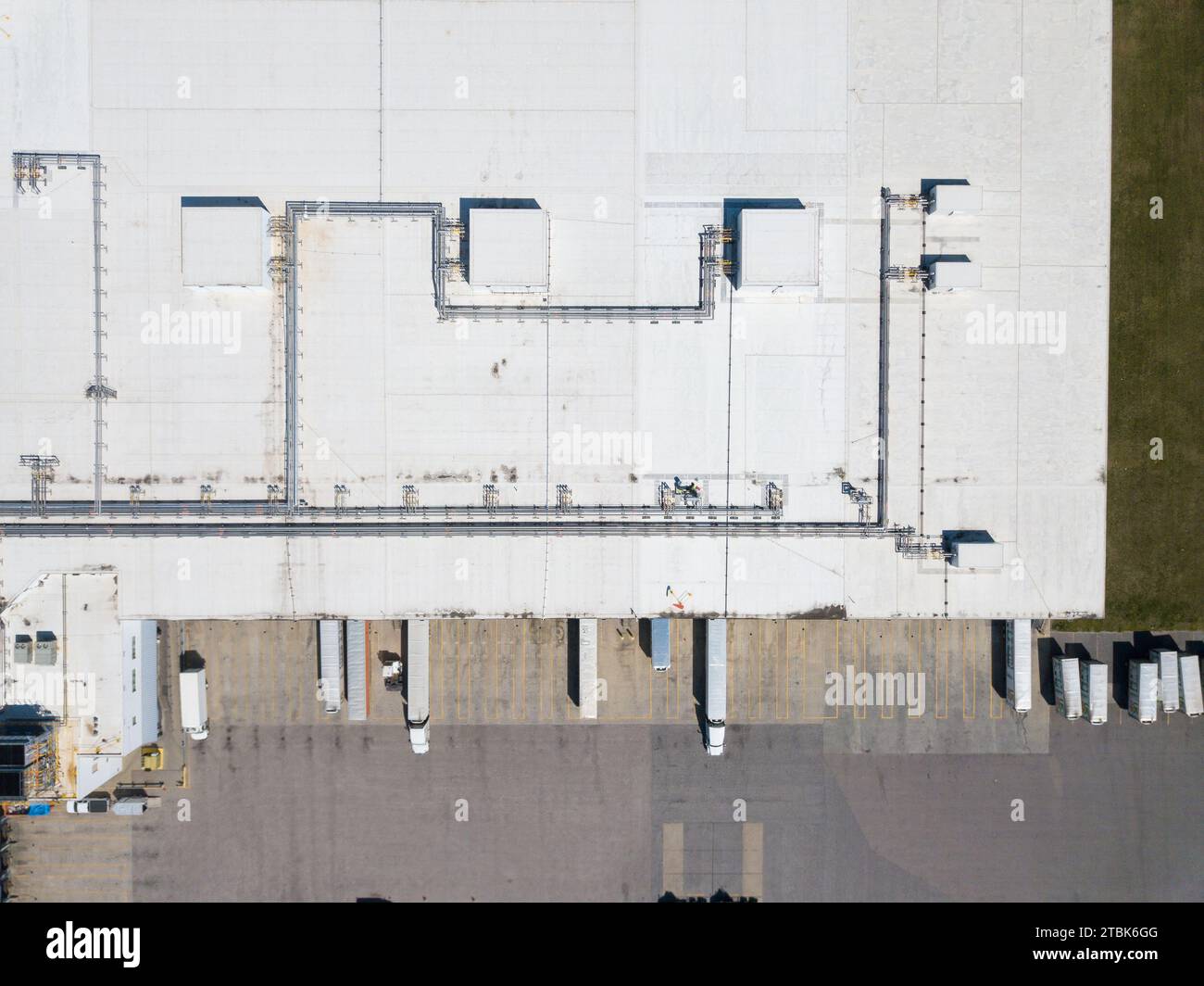 Drone images of the roof of a food distribution warehouse, and a ...