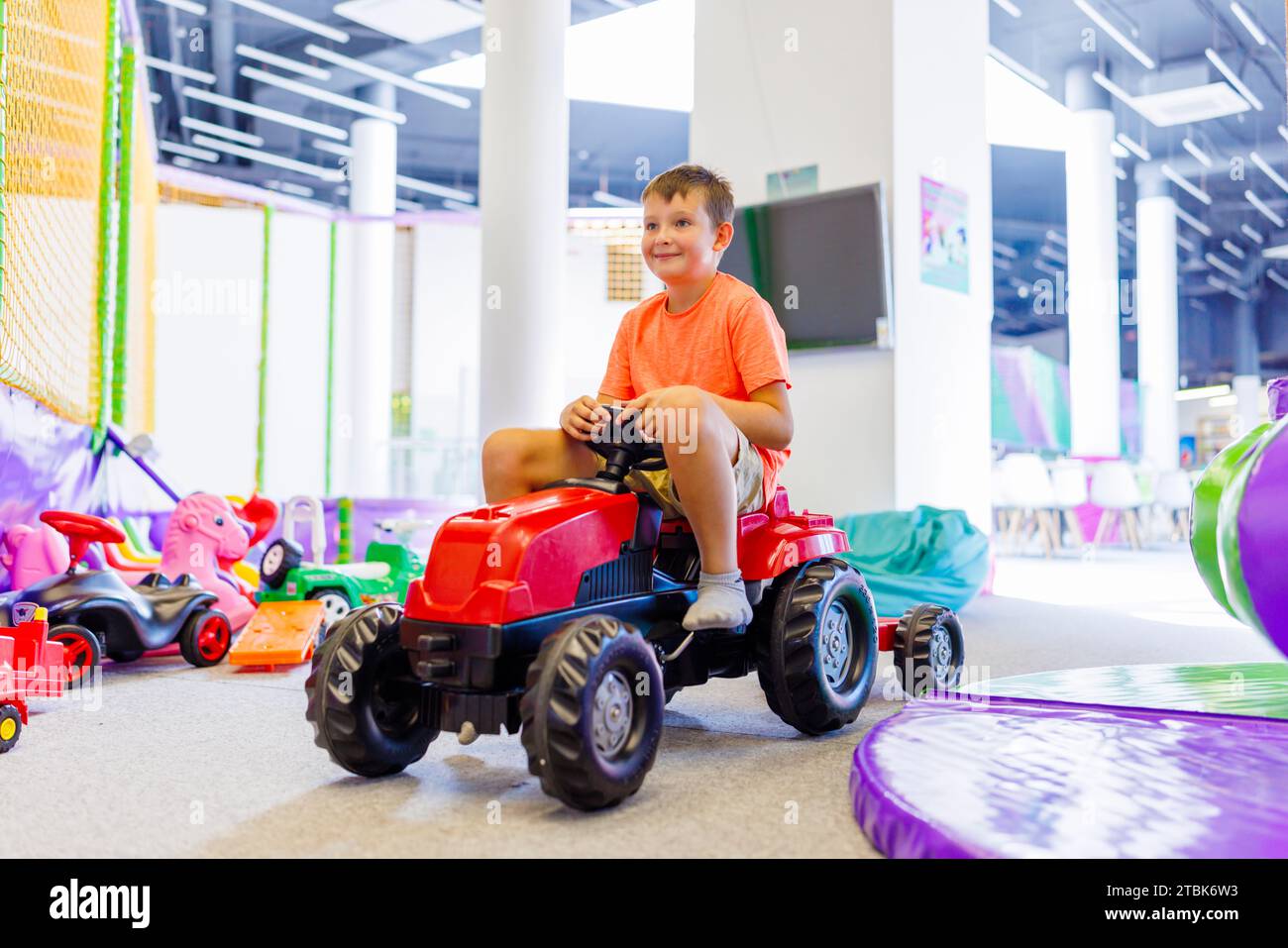 Children play pedal car hi-res stock photography and images - Alamy