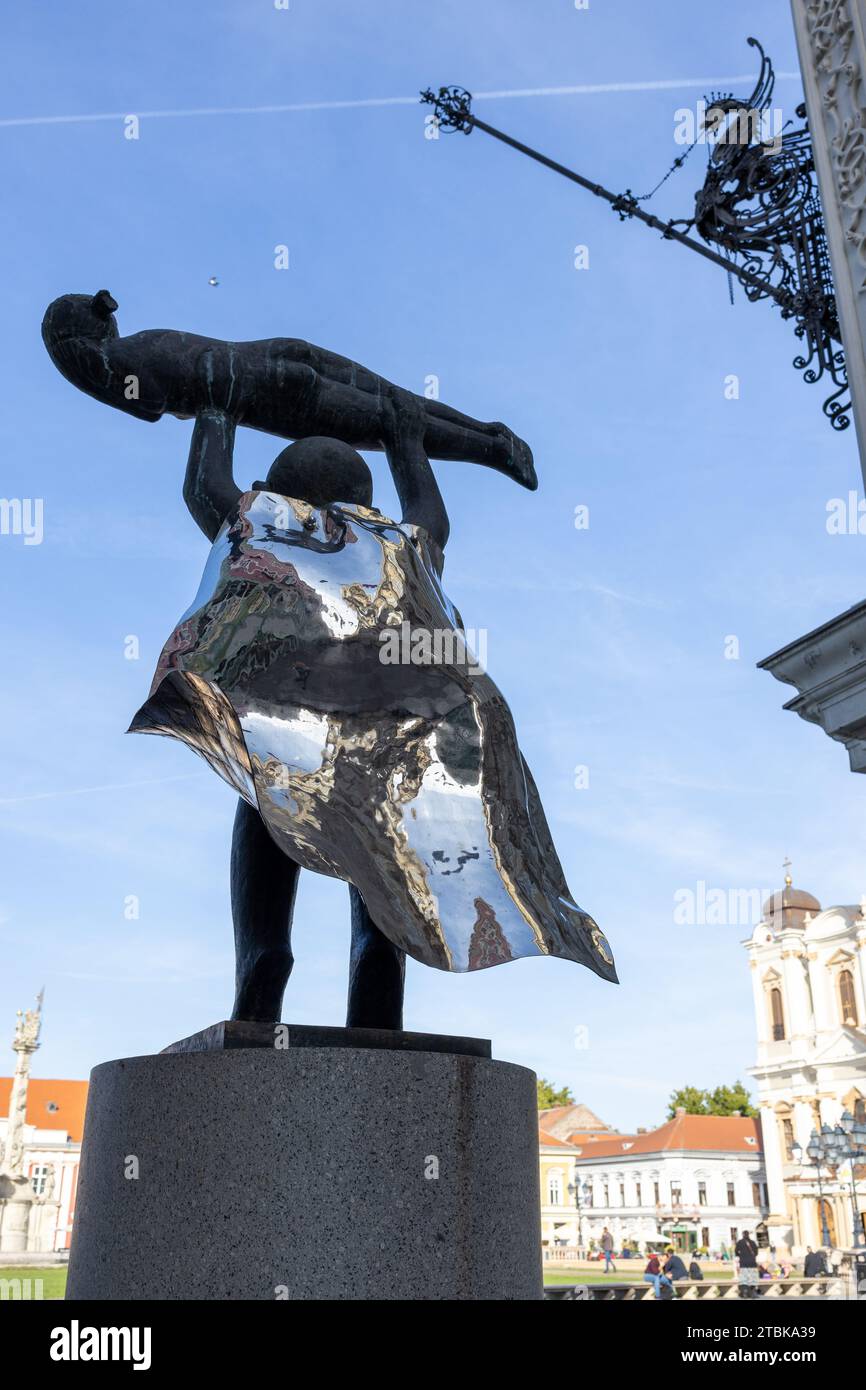 An artistic bronze sculpture depicting two men interacting with each ...