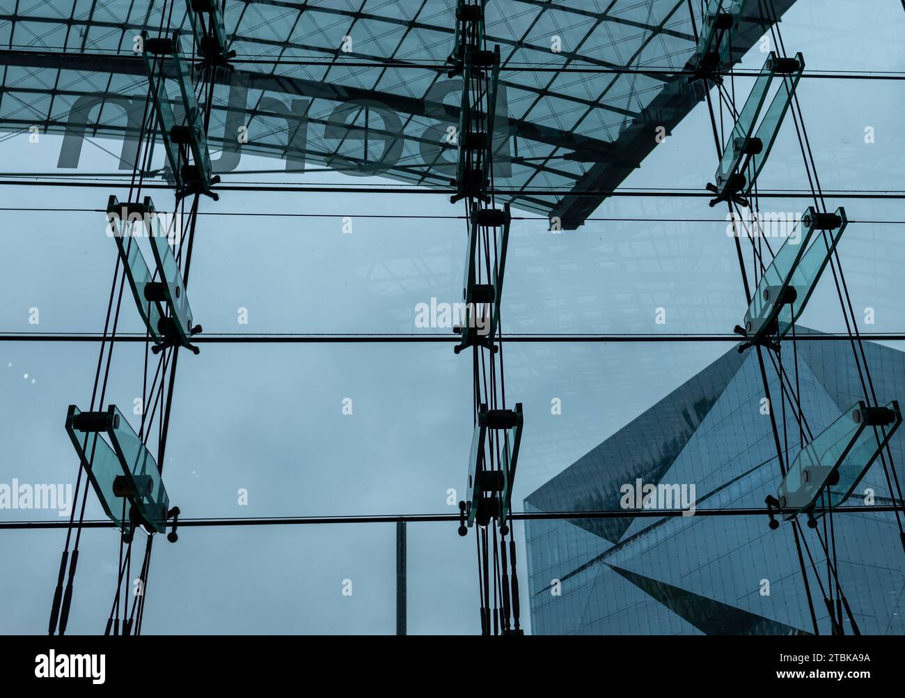 A stunning reflection of three imposing skyscrapers is captured in the ...