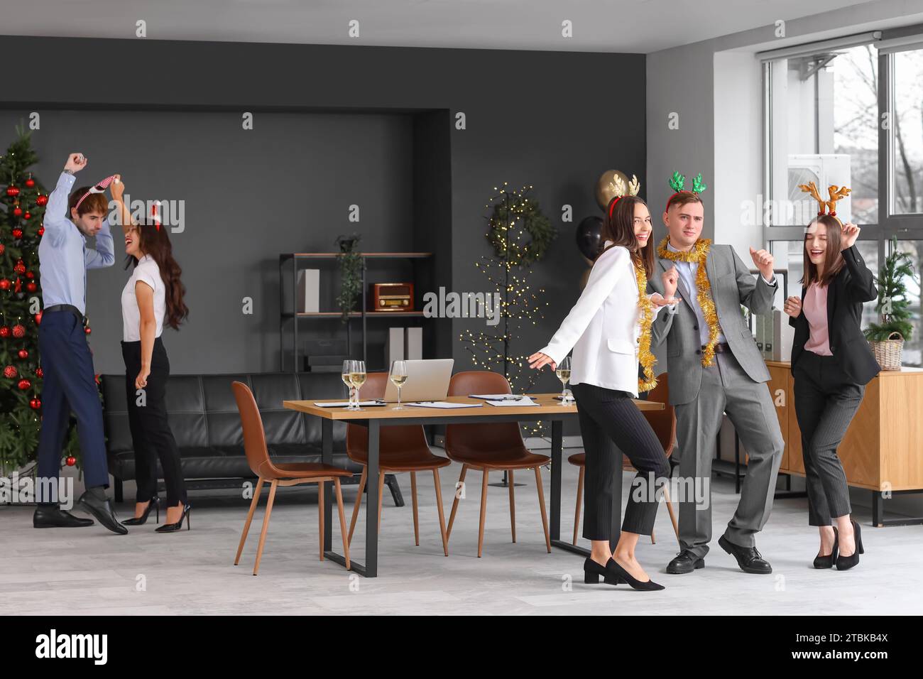 Young colleagues dancing at New Year party in office Stock Photo - Alamy