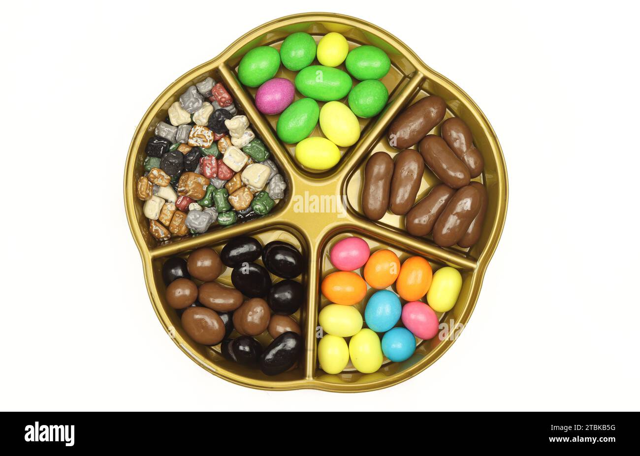 Plastic five section divider plate filled with colorful chocolate ...