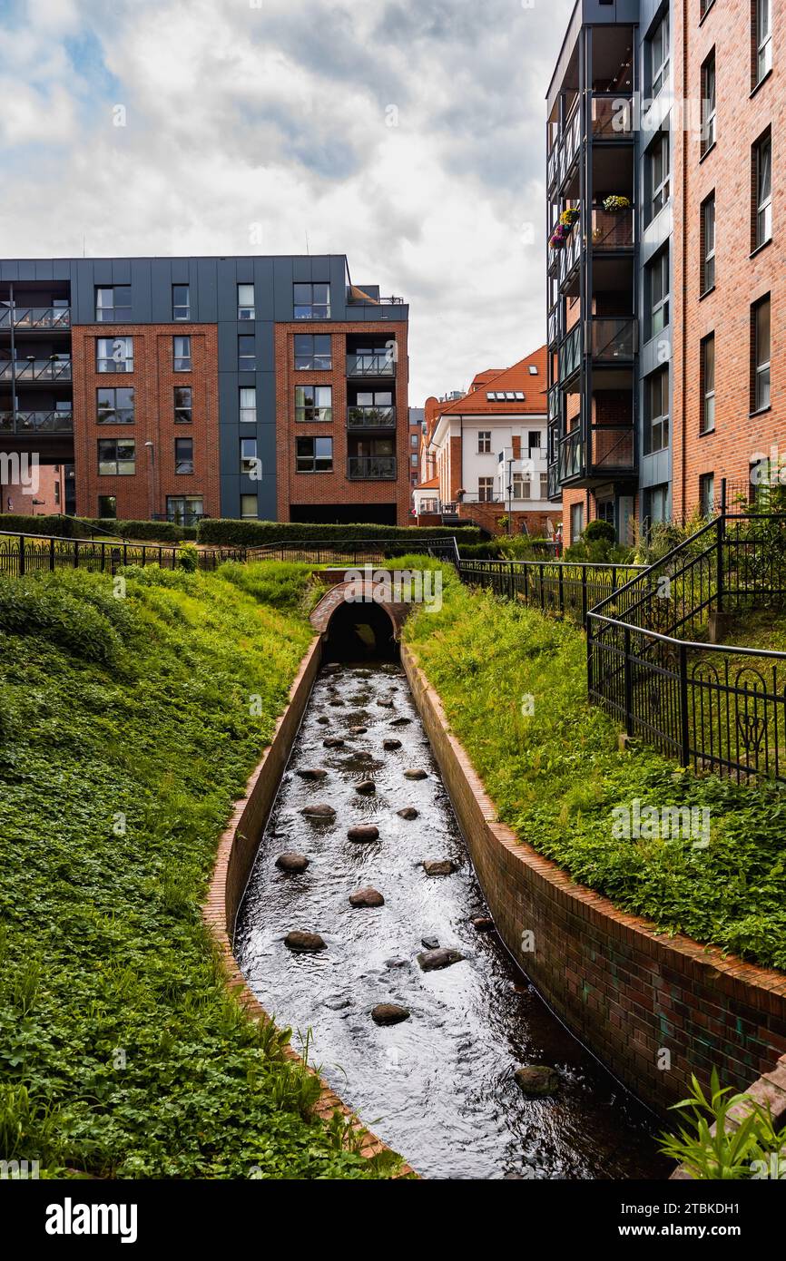 Gdansk, Poland - July 23 2023: Small water stream with few decorative ...