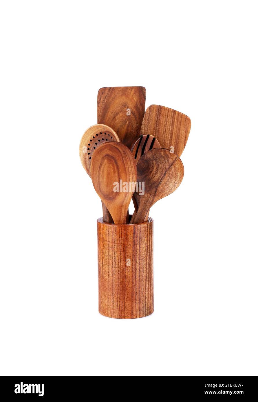 Set of wooden kitchen utensils in container isolated on white ...