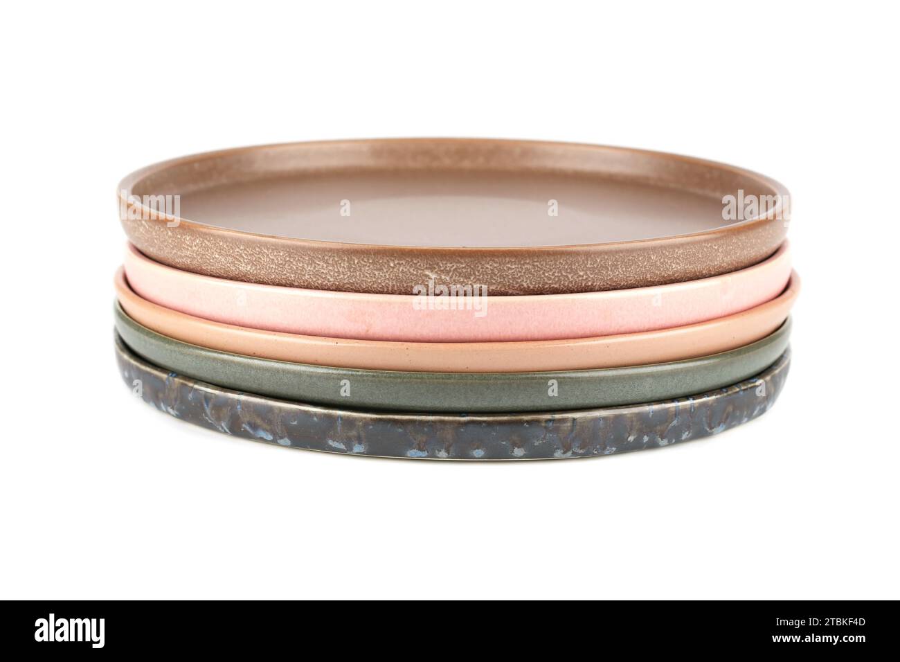 Stack of colorful plates isolated on white background Stock Photo - Alamy