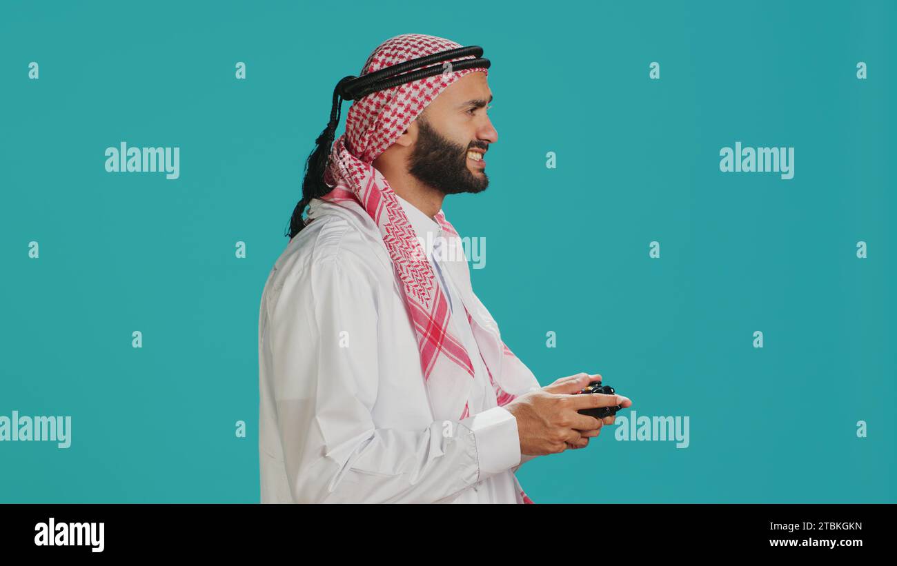 Modern person playing online games with controller, having fun with ...