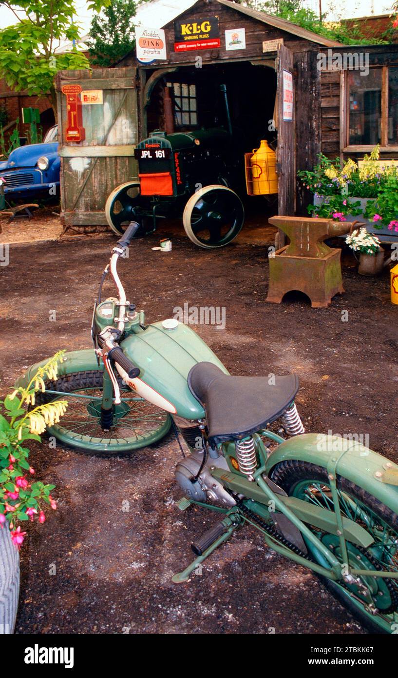 Traditional garage with old motorcycle Stock Photo - Alamy