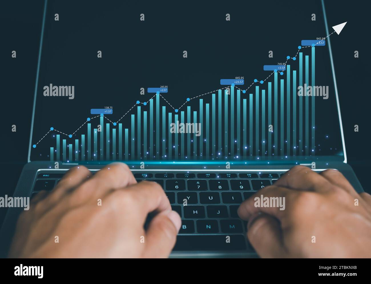 Human hand taps his finger on his computer to display a graph with ...