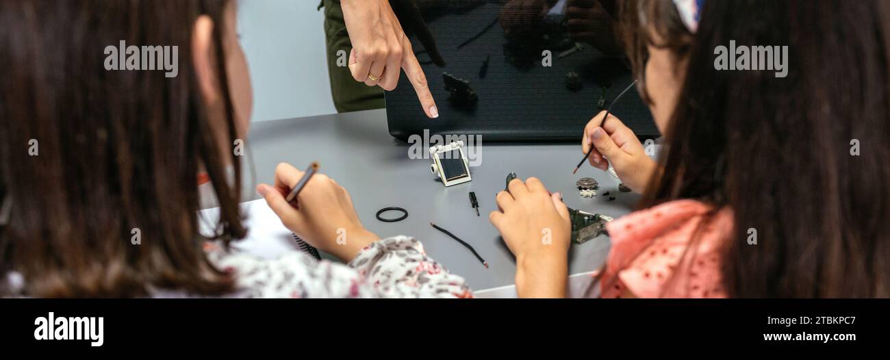Teacher showing solar panel to her students in a robotics class Stock ...
