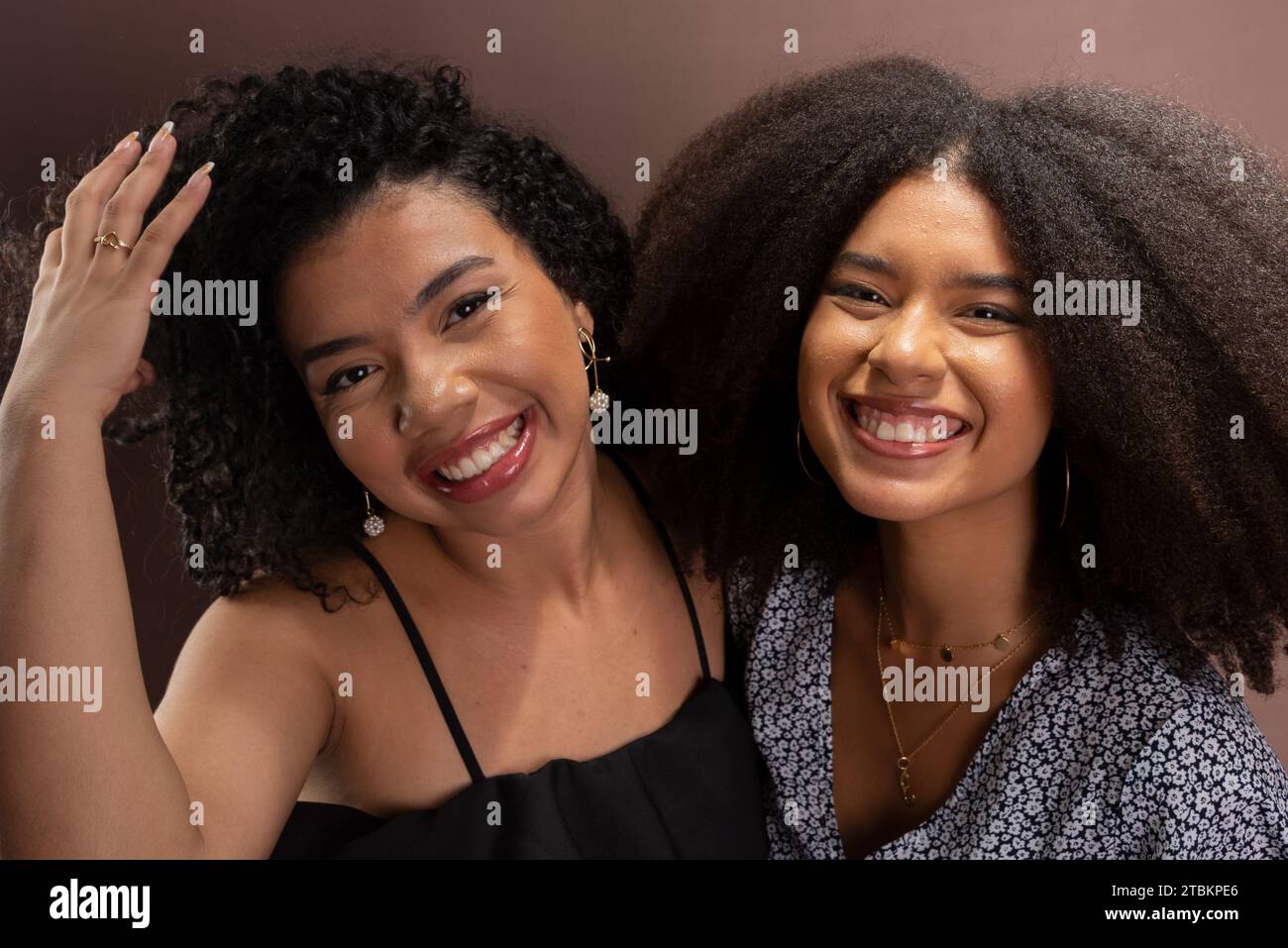 Half-closed portrait of two happy young friends. Friendship concept ...