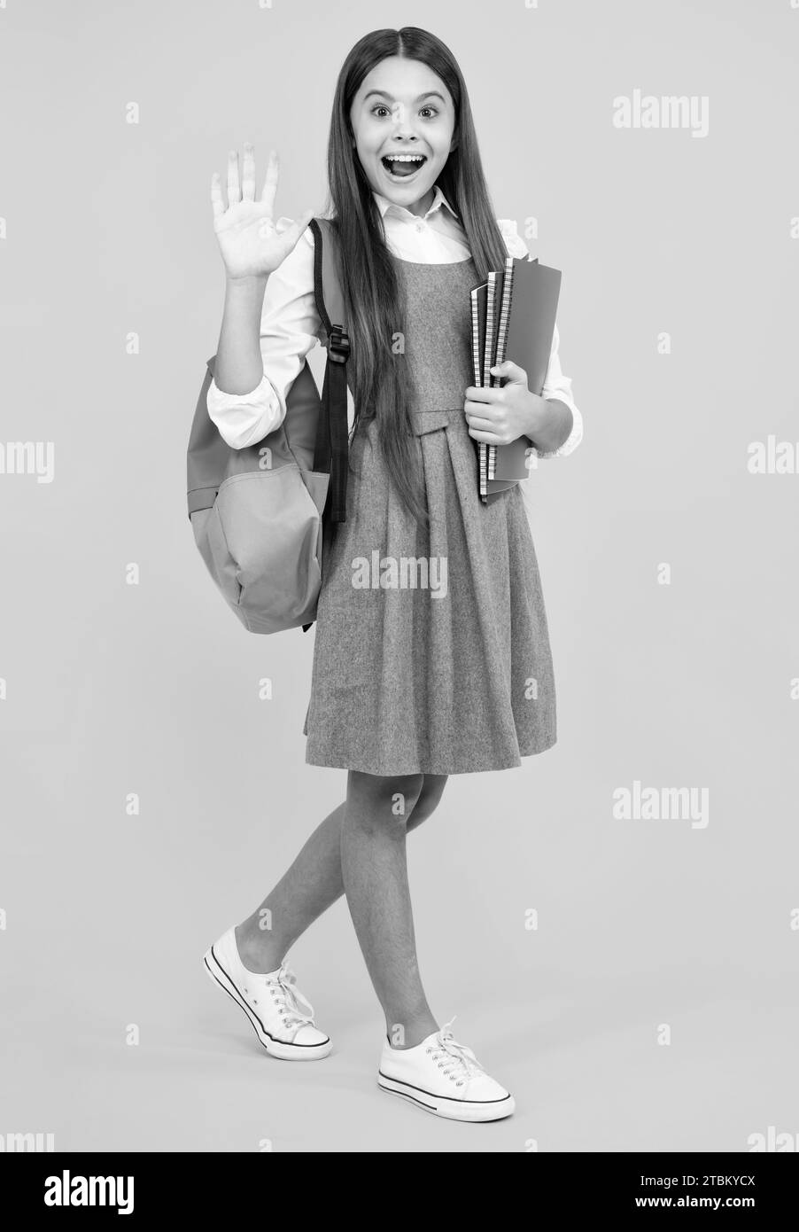 Excited face. School teenager child girl with book and copybook ...