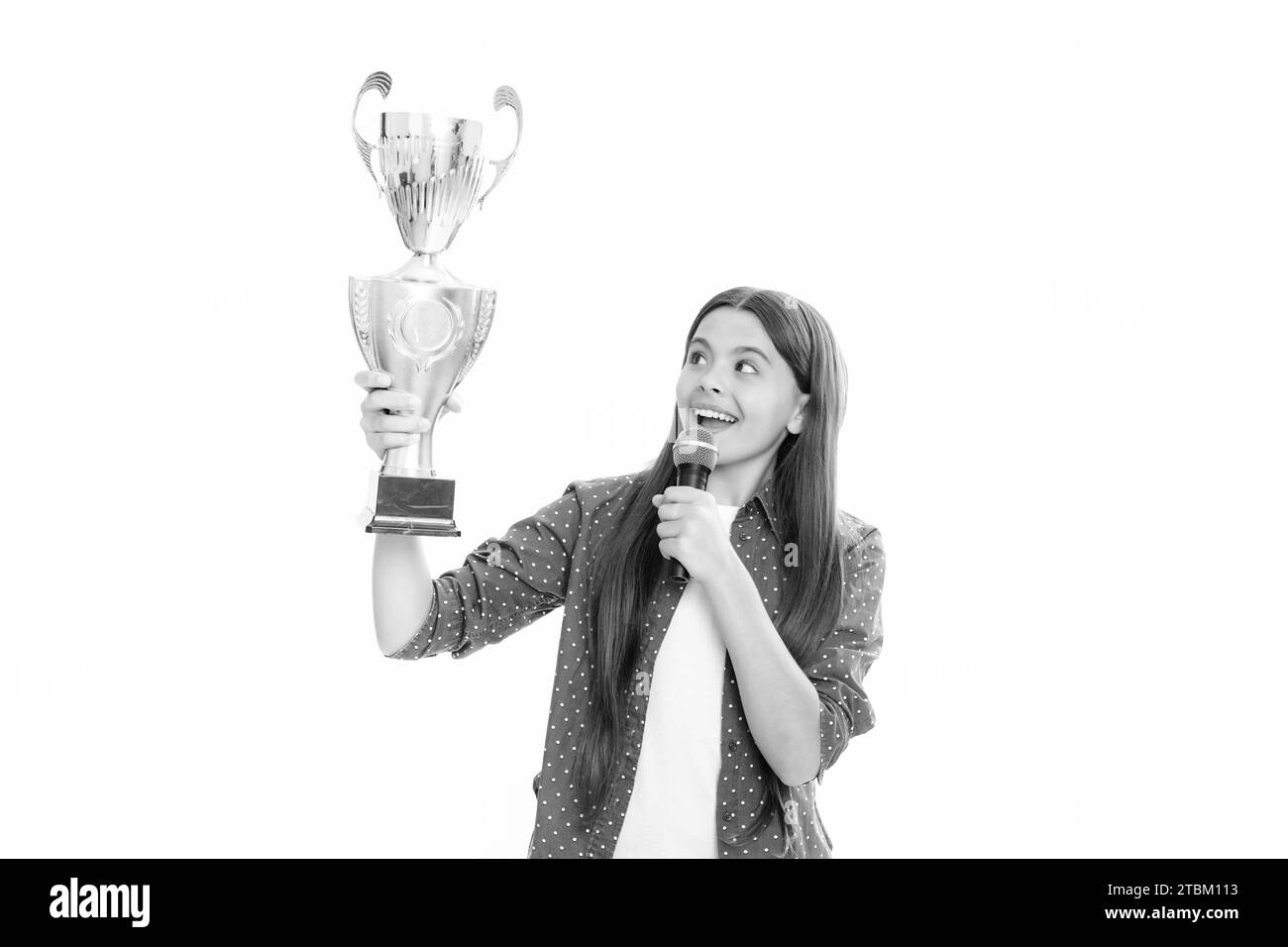 Teenage girl holding a trophy microphone speech. Kid winner child won ...