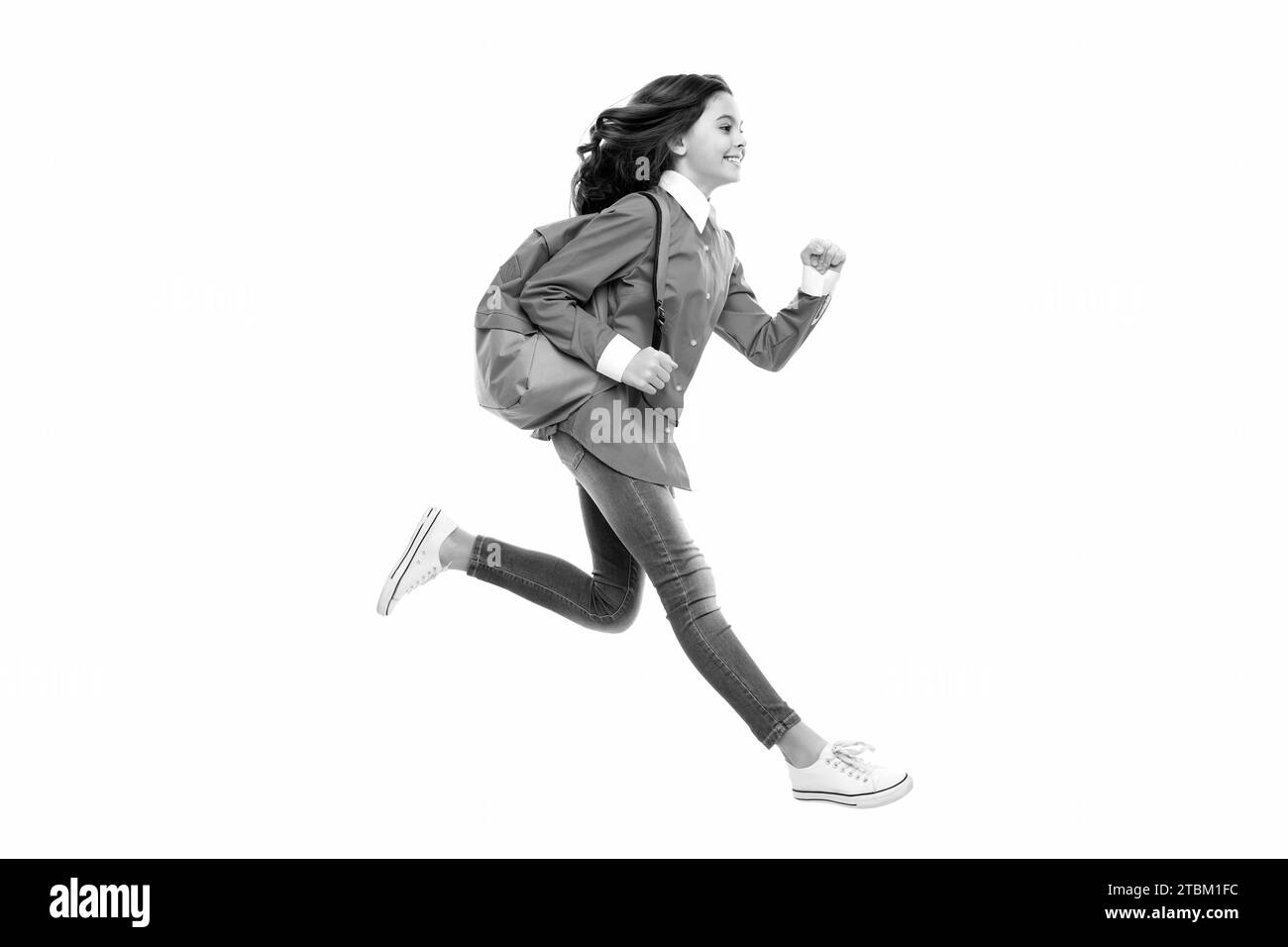 School girl in school uniform with school bag. Run and jump ...