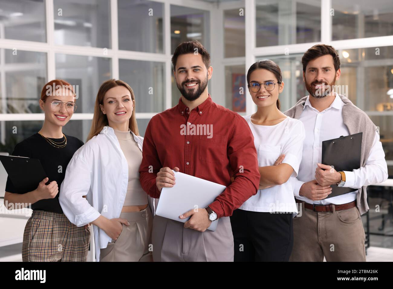 Portrait of happy employees in office. Team work Stock Photo - Alamy
