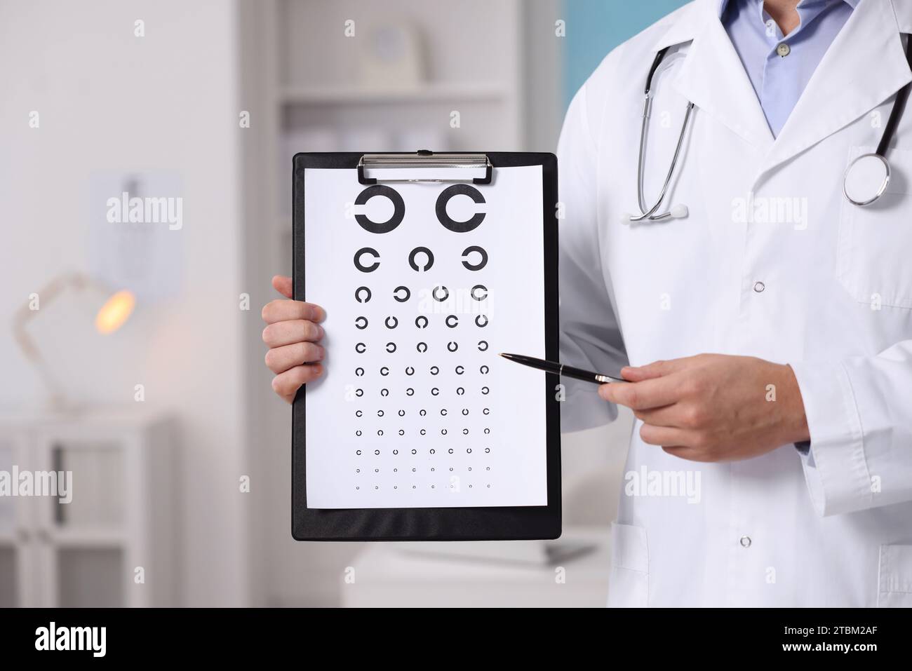 Ophthalmologist pointing at vision test chart in clinic, closeup Stock ...
