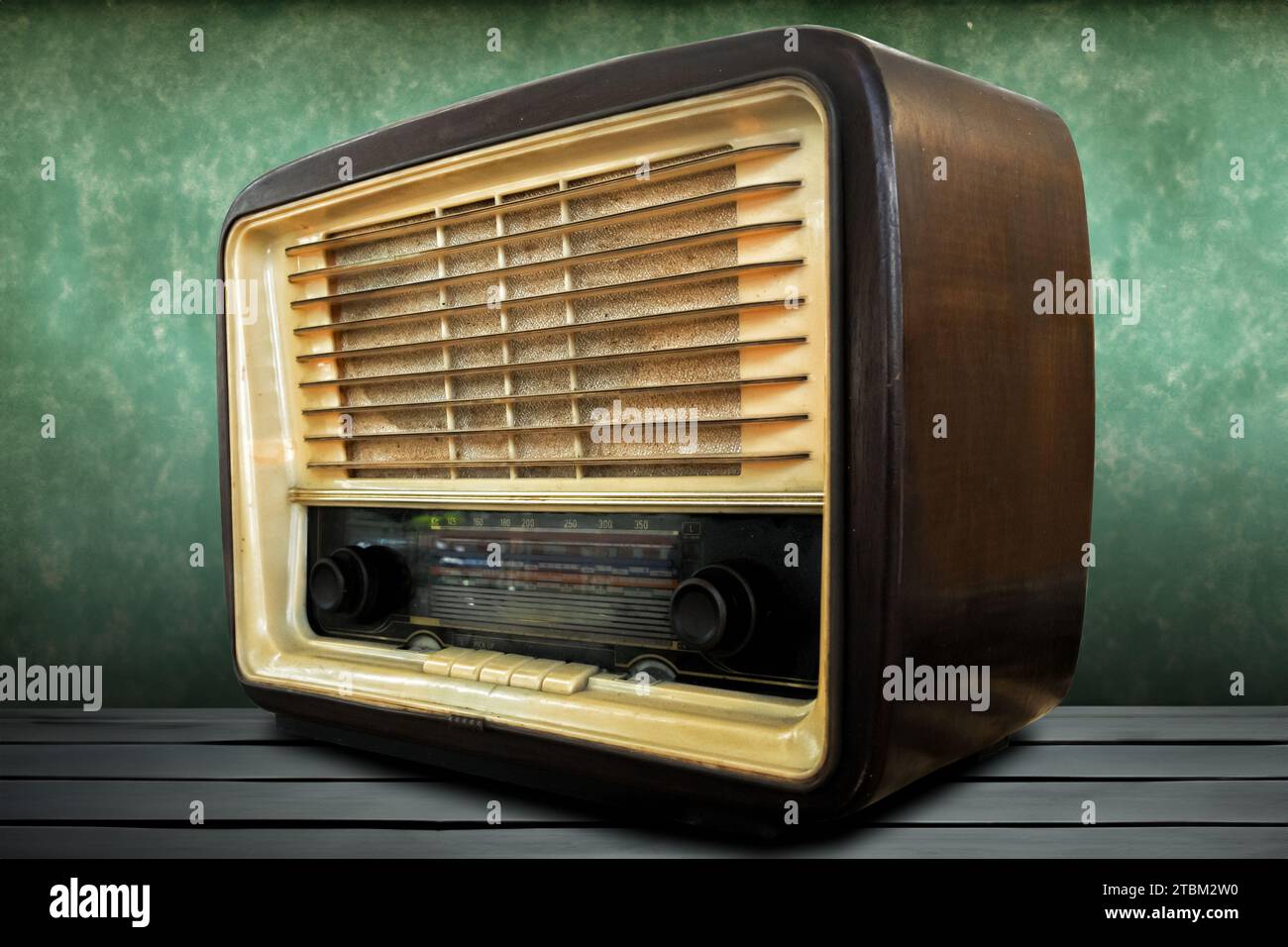 An old AM radio with analog frequency search buttons and needles on a ...