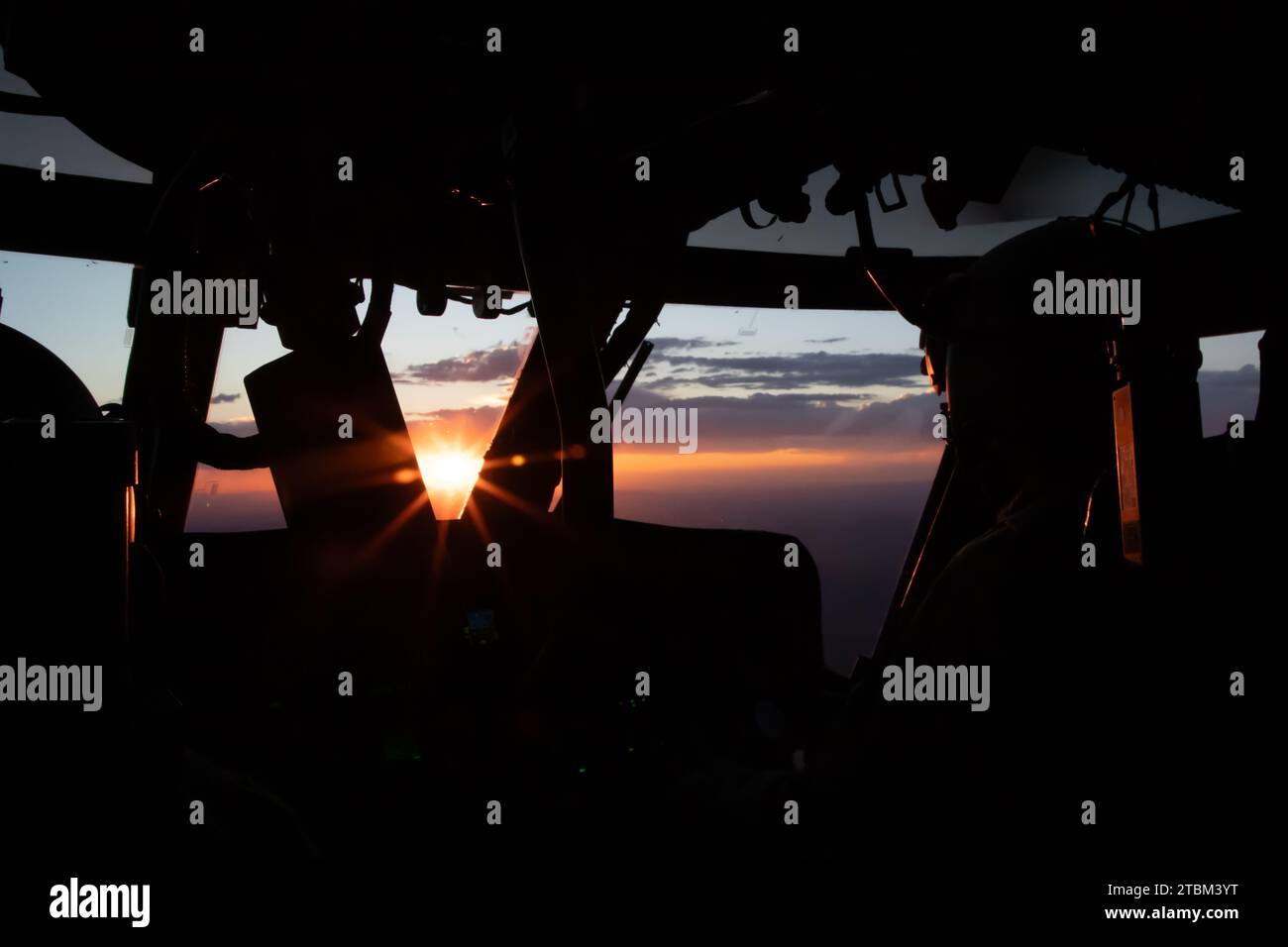 Sunset view from inside a UH-60M Black Hawk, assigned to Alpha Company ...