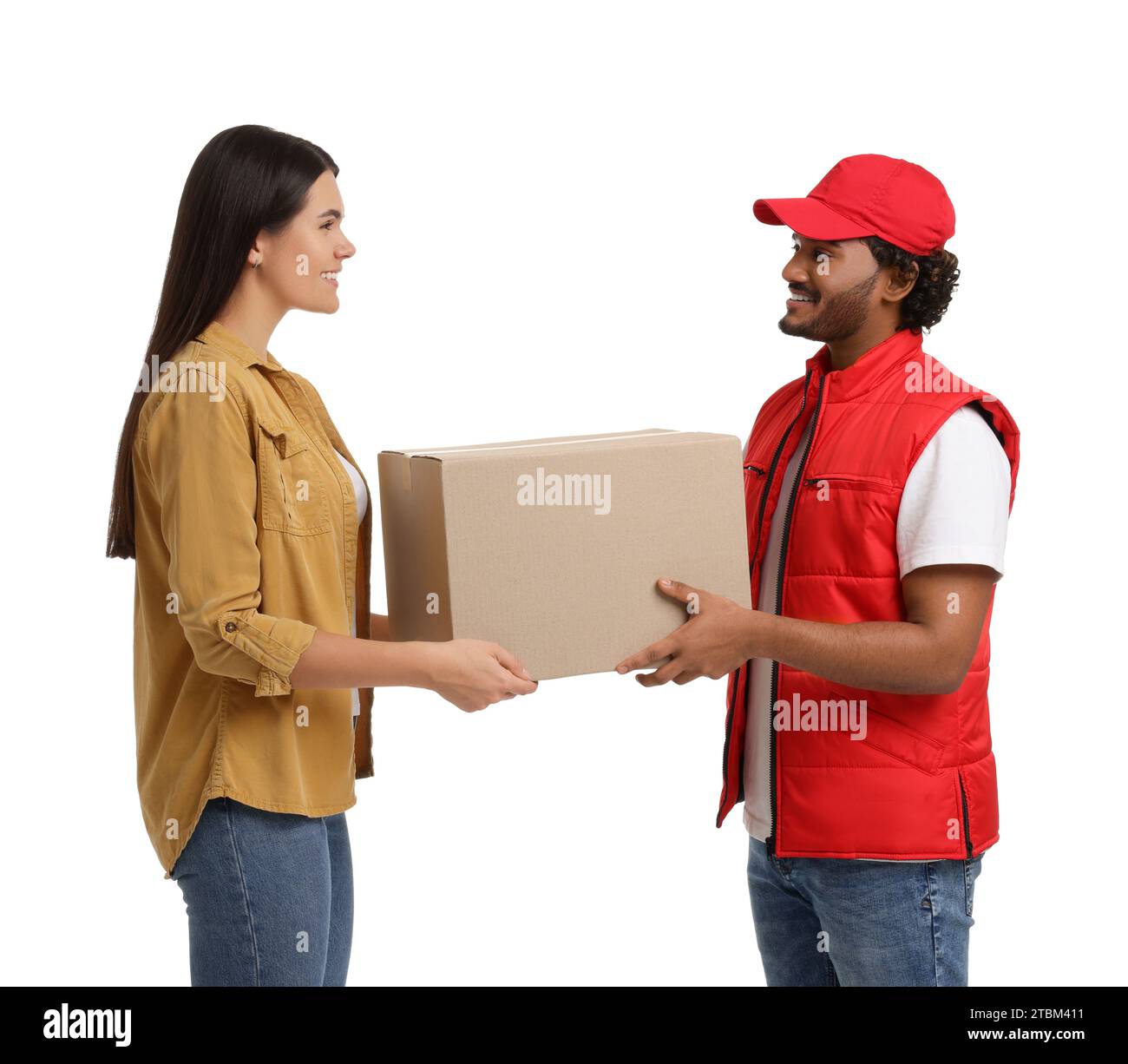 Smiling courier giving parcel to receiver on white background Stock ...