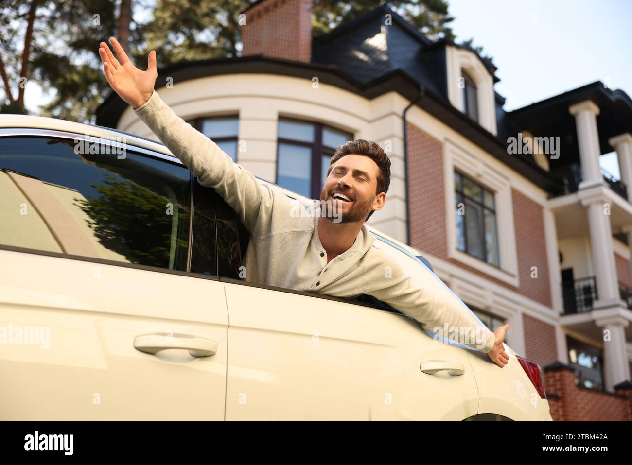 Man leaning out of car window hi-res stock photography and images - Alamy