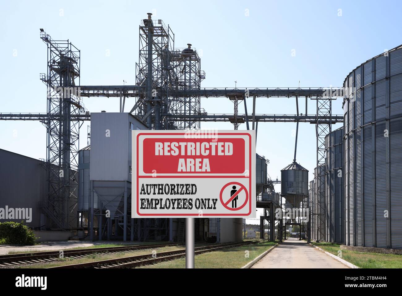 Sign with text Restricted Area Authorized Employees Only near granaries ...