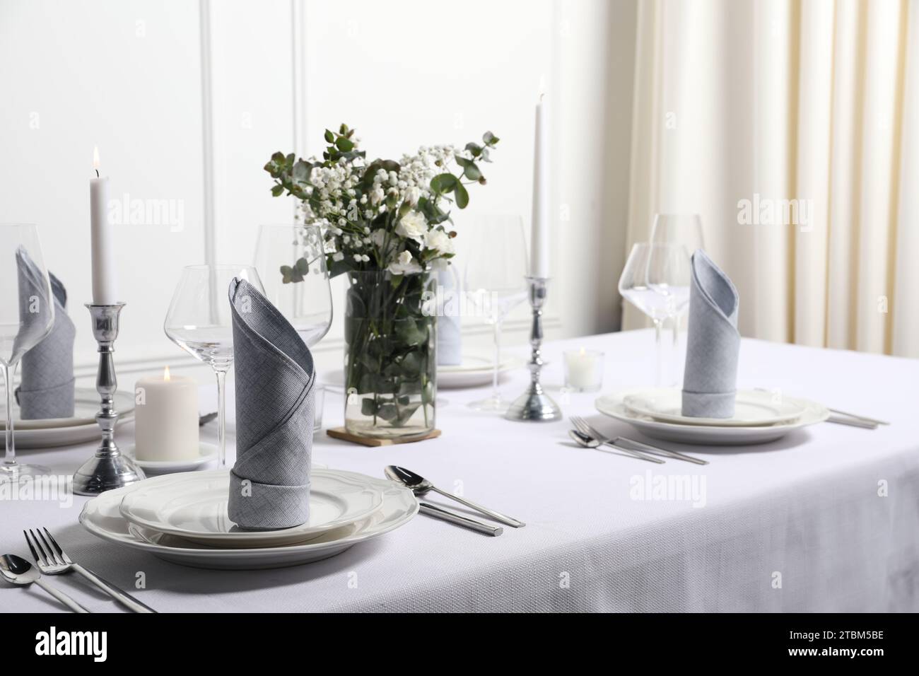 Beautiful table setting with floral decor indoors Stock Photo - Alamy