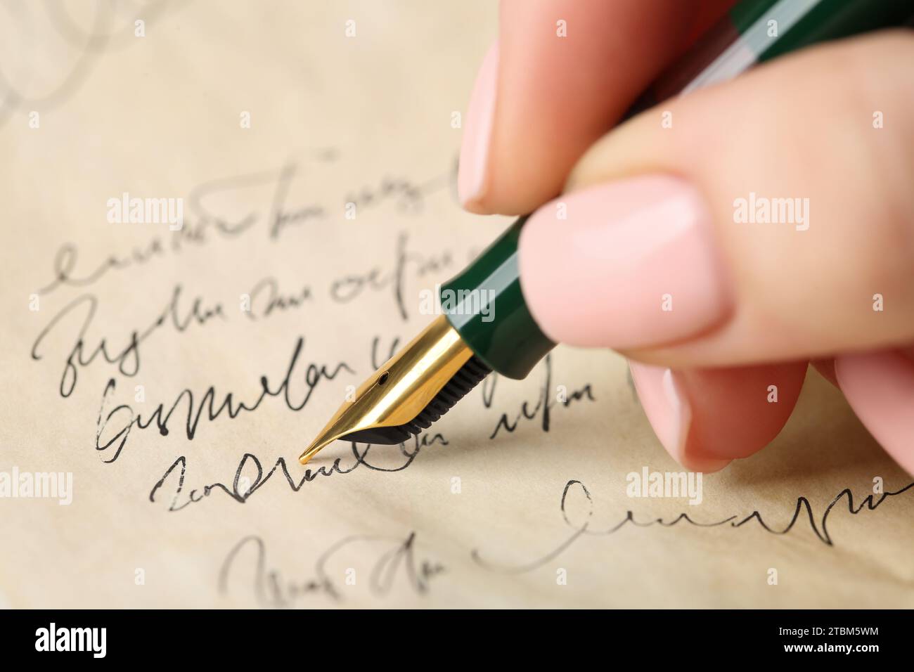 Woman writing letter with fountain pen, closeup Stock Photo - Alamy