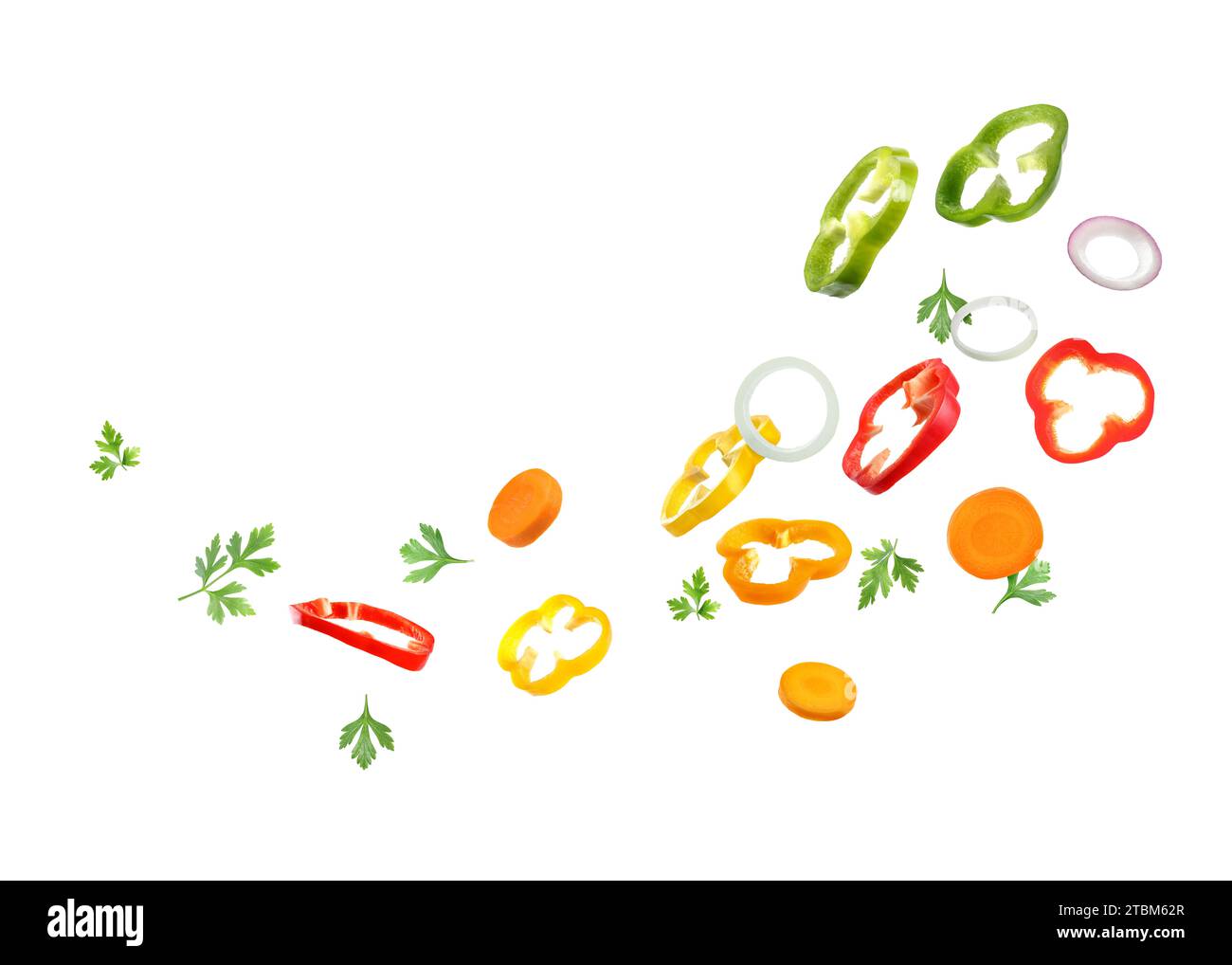 Fresh parsley and slices of bell pepper flying on white background ...