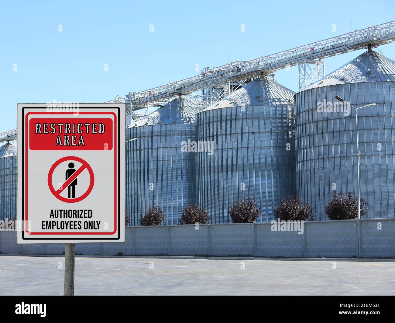 Sign with text Restricted Area Authorized Employees Only near granaries ...