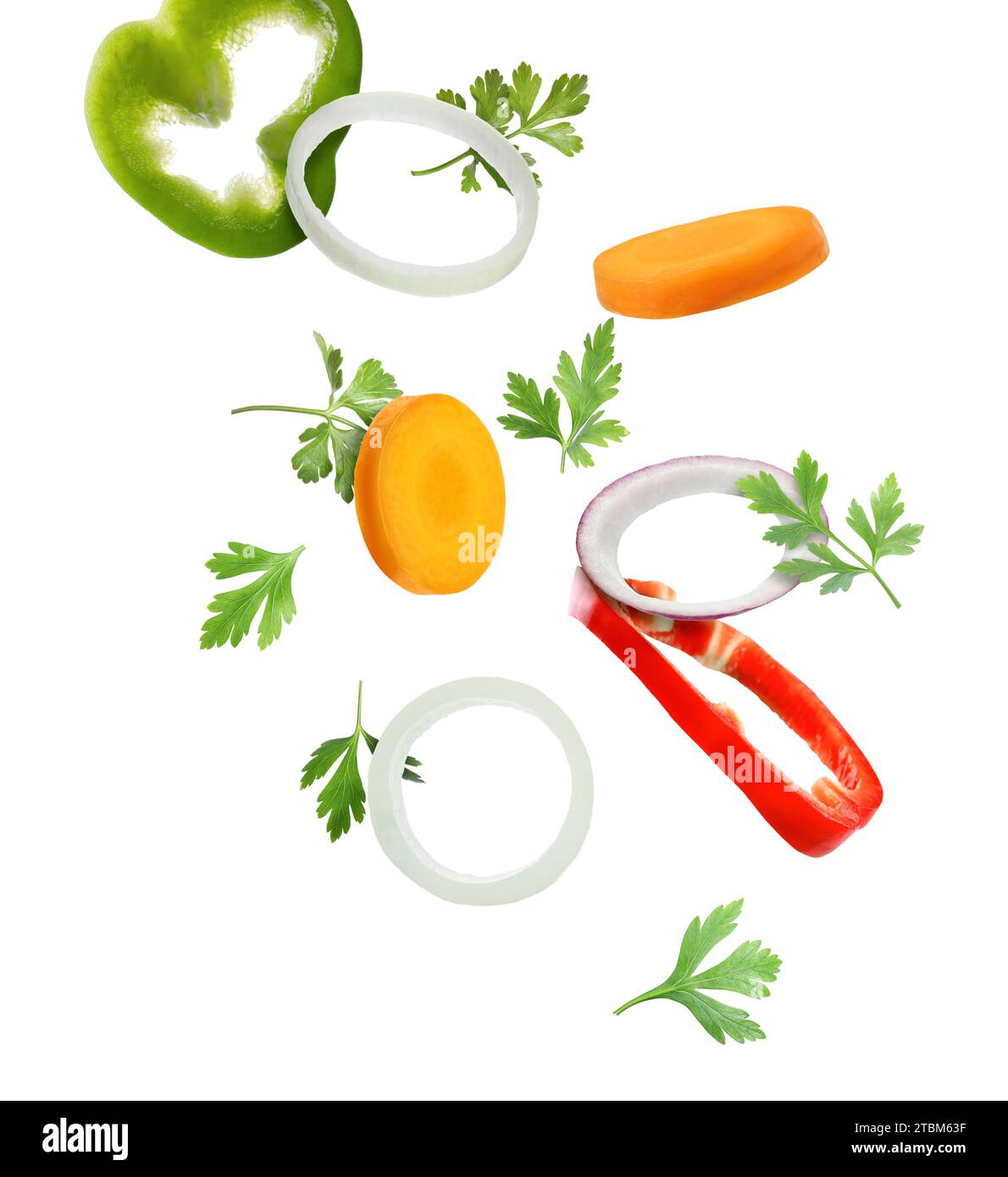 Fresh parsley, bell pepper, onion and carrot flying on white background ...