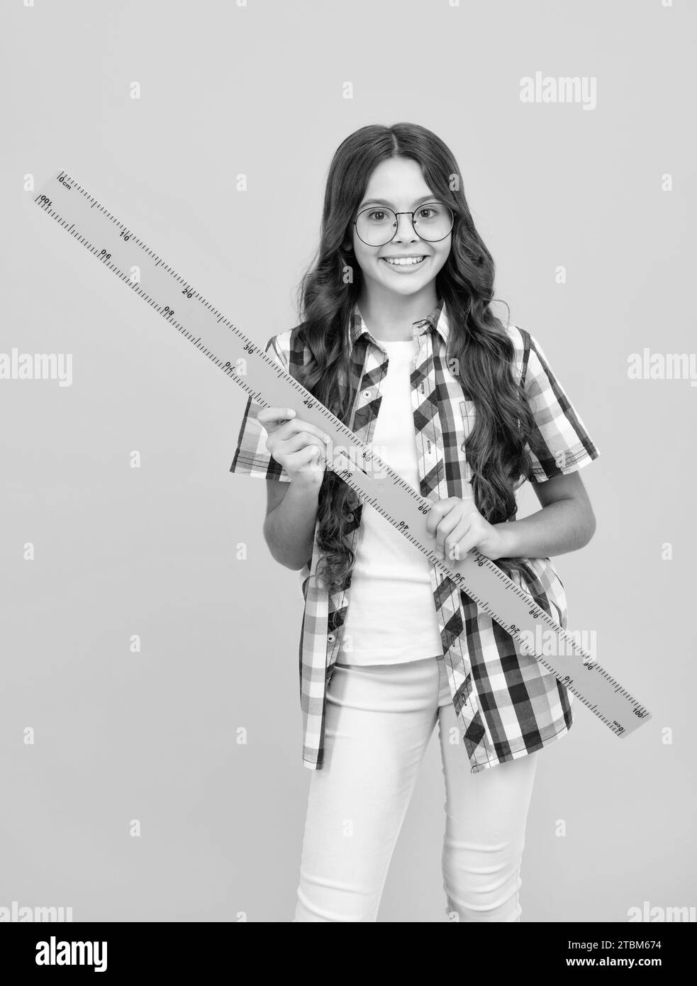 Teenager child school girl holding measure for geometry lesson ...