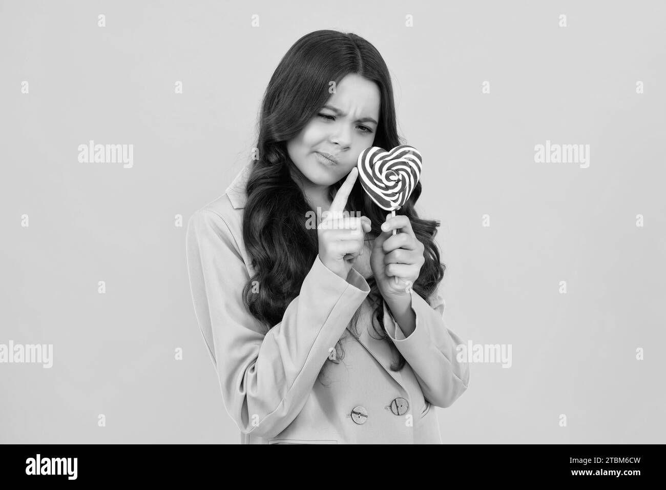 Teenager girl with caramel candies on sticks, sweet sugar addiction ...
