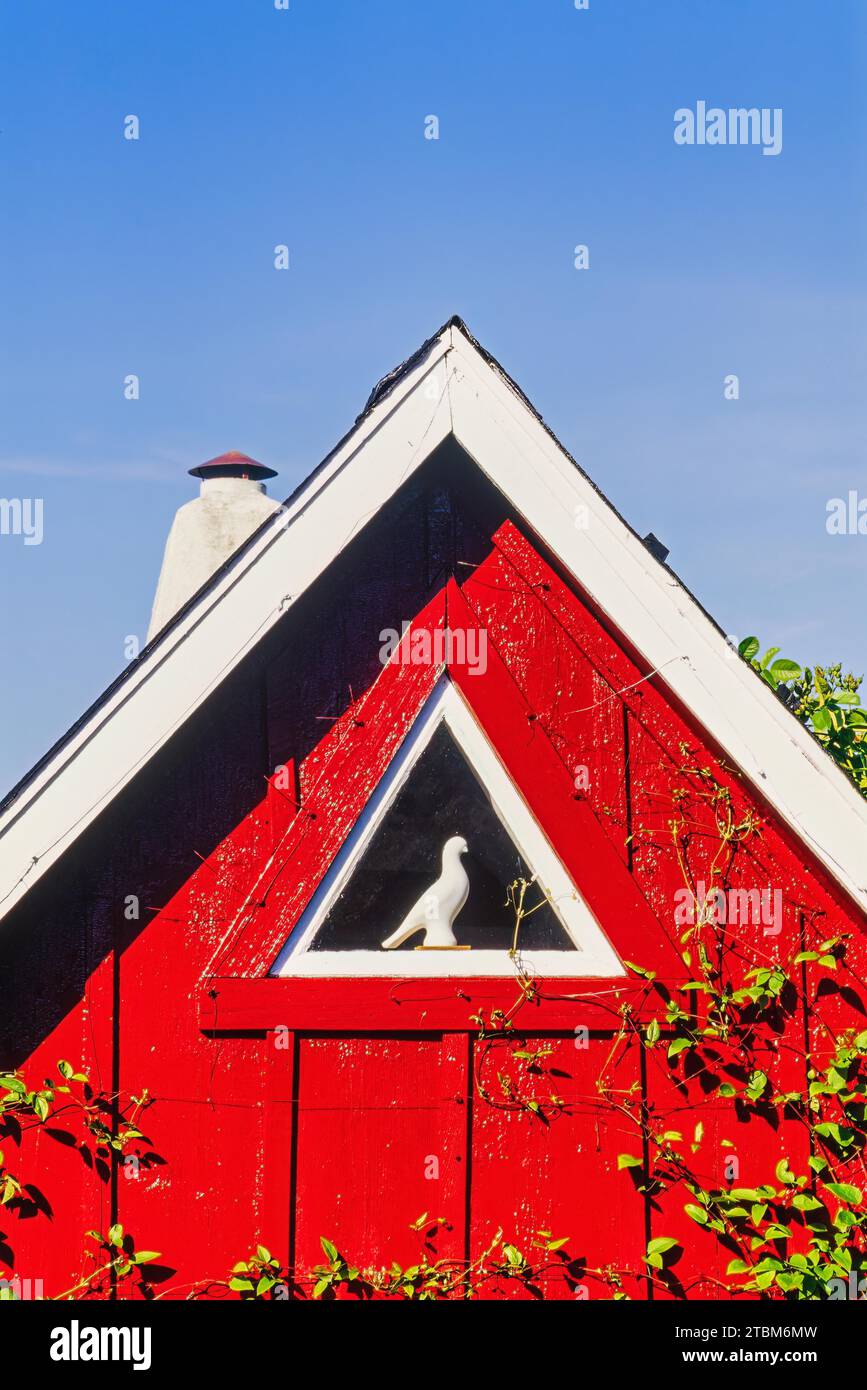 Red house gable with a white dove in a triangle window, Sweden Stock ...