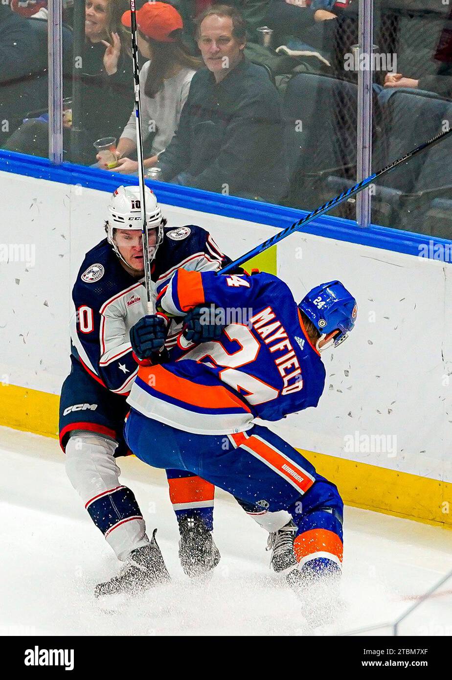 Columbus Blue Jackets left wing Dmitri Voronkov takes a hit from New ...