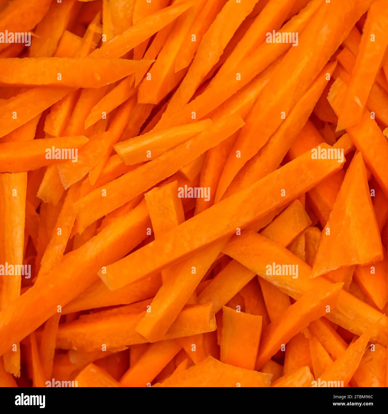 Coarsely chopped orange carrot. The process of cooking pilaf. Fresh ...