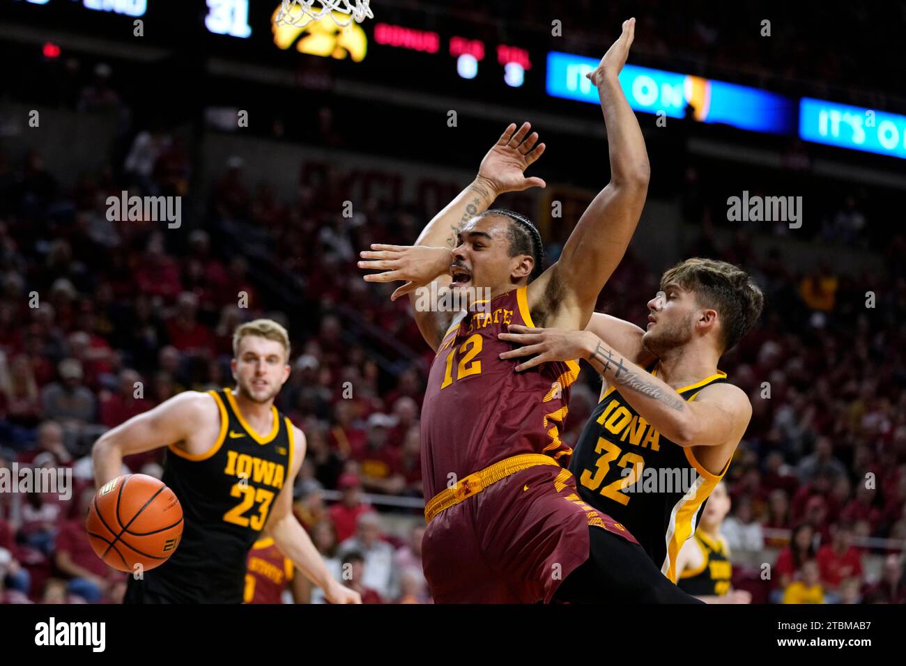 Iowa State forward Robert Jones (12) is fouled by Iowa forward Owen ...