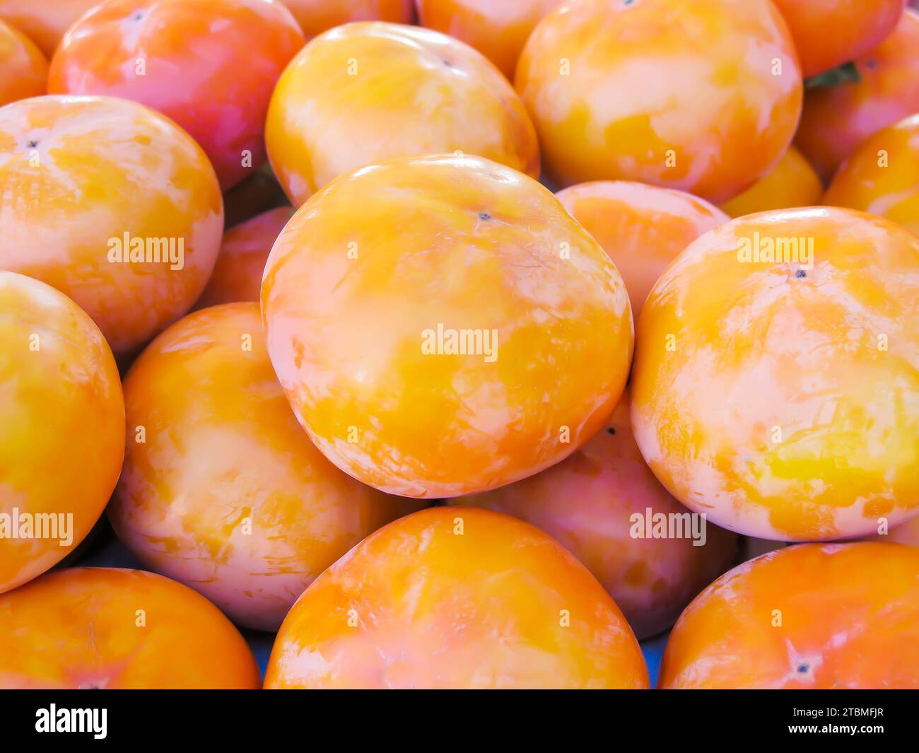Organic persimmons hi-res stock photography and images - Alamy