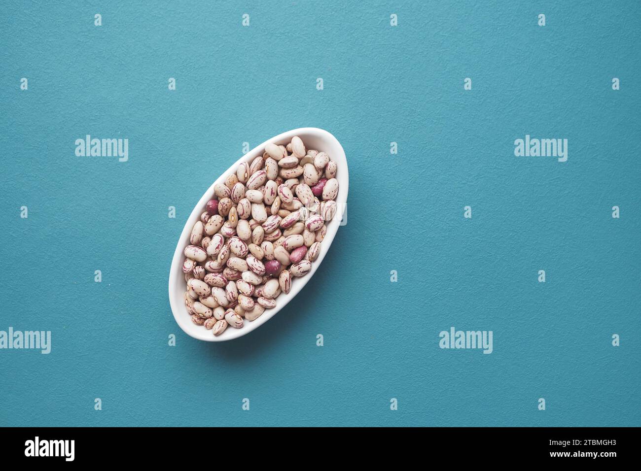 high protein Beans in a bowl on light blue background Stock Photo - Alamy