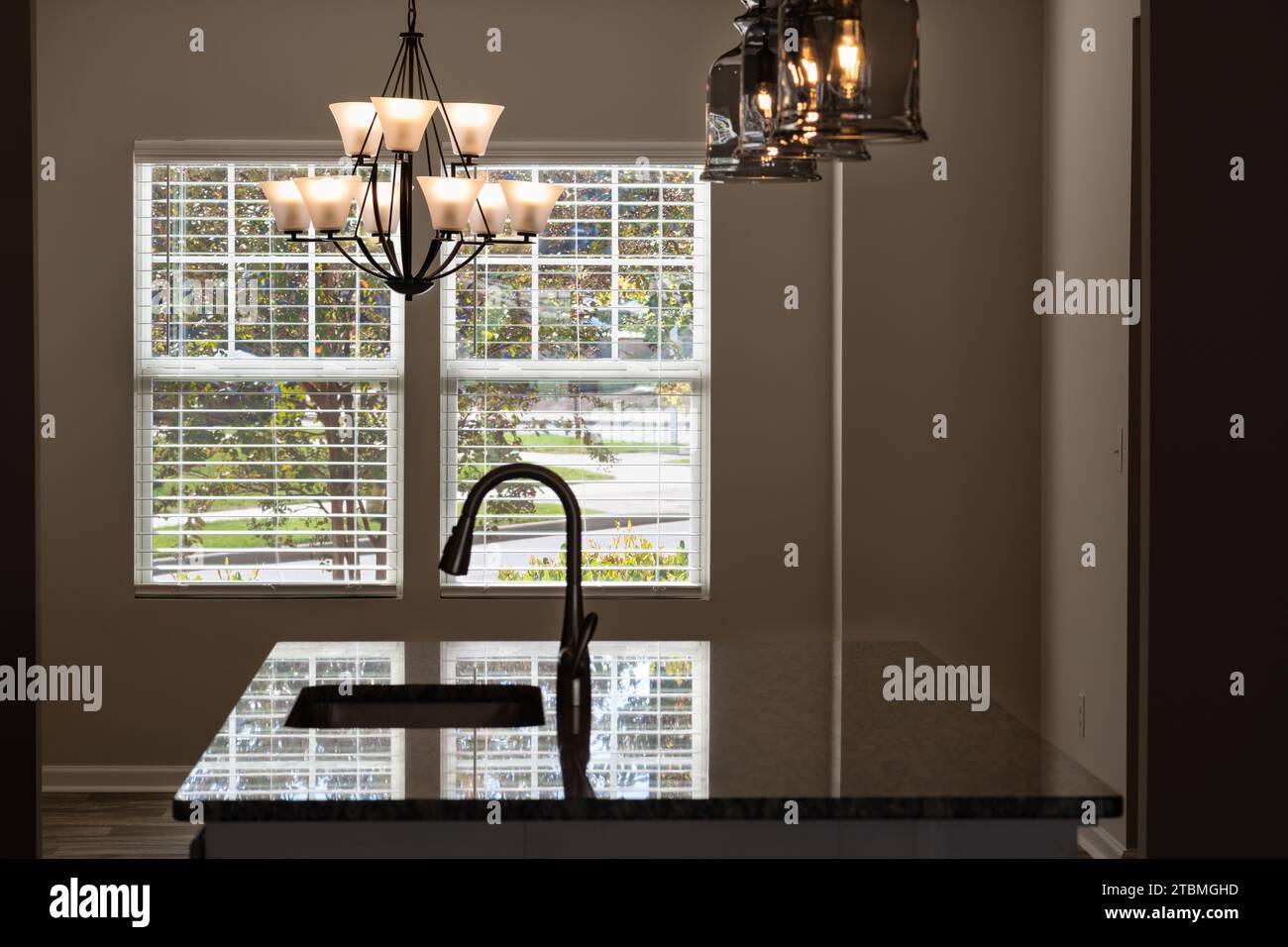 Modern townhouse kitchen with dinning room window view and lighting ...