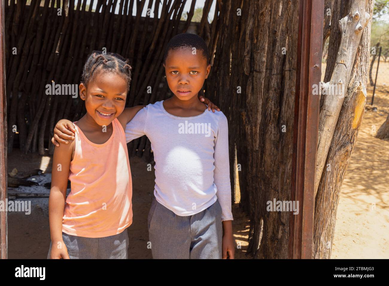 village african kids, with braids hairstyle , standing in front of the ...