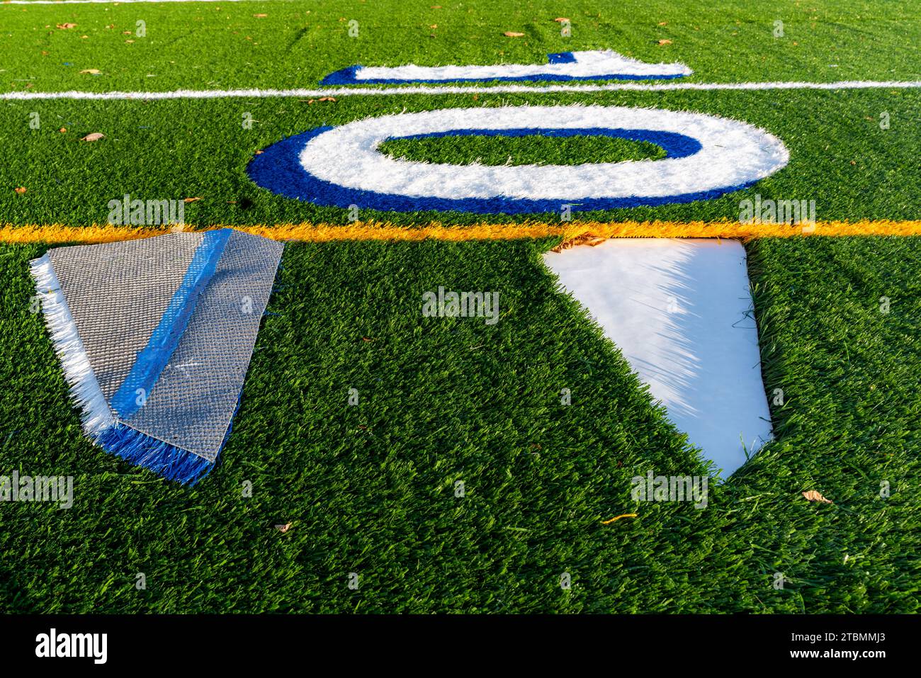 Synthetic turf field under construction with lines and graphics being ...