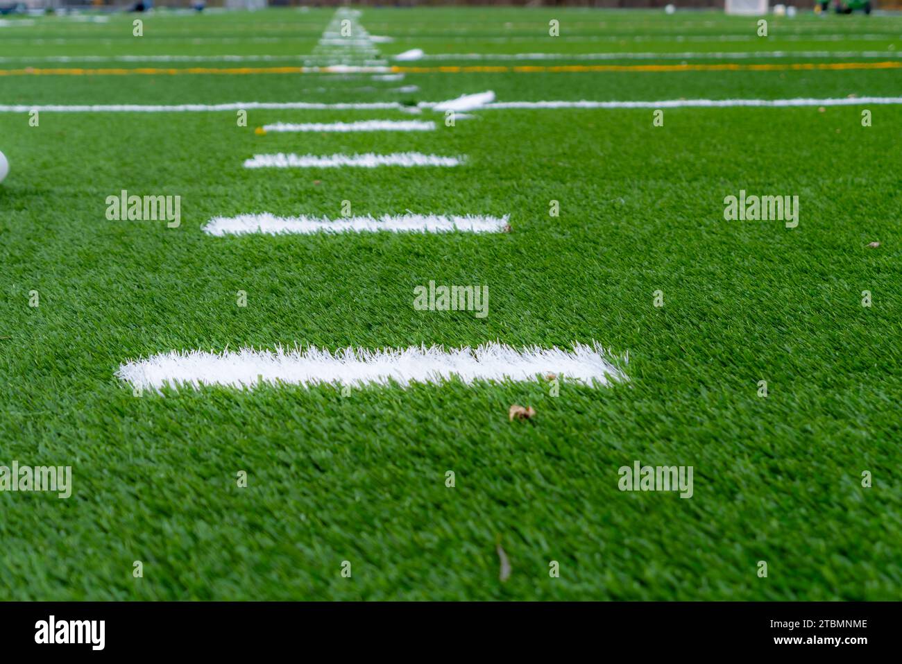 Synthetic turf field under construction with lines and graphics being ...