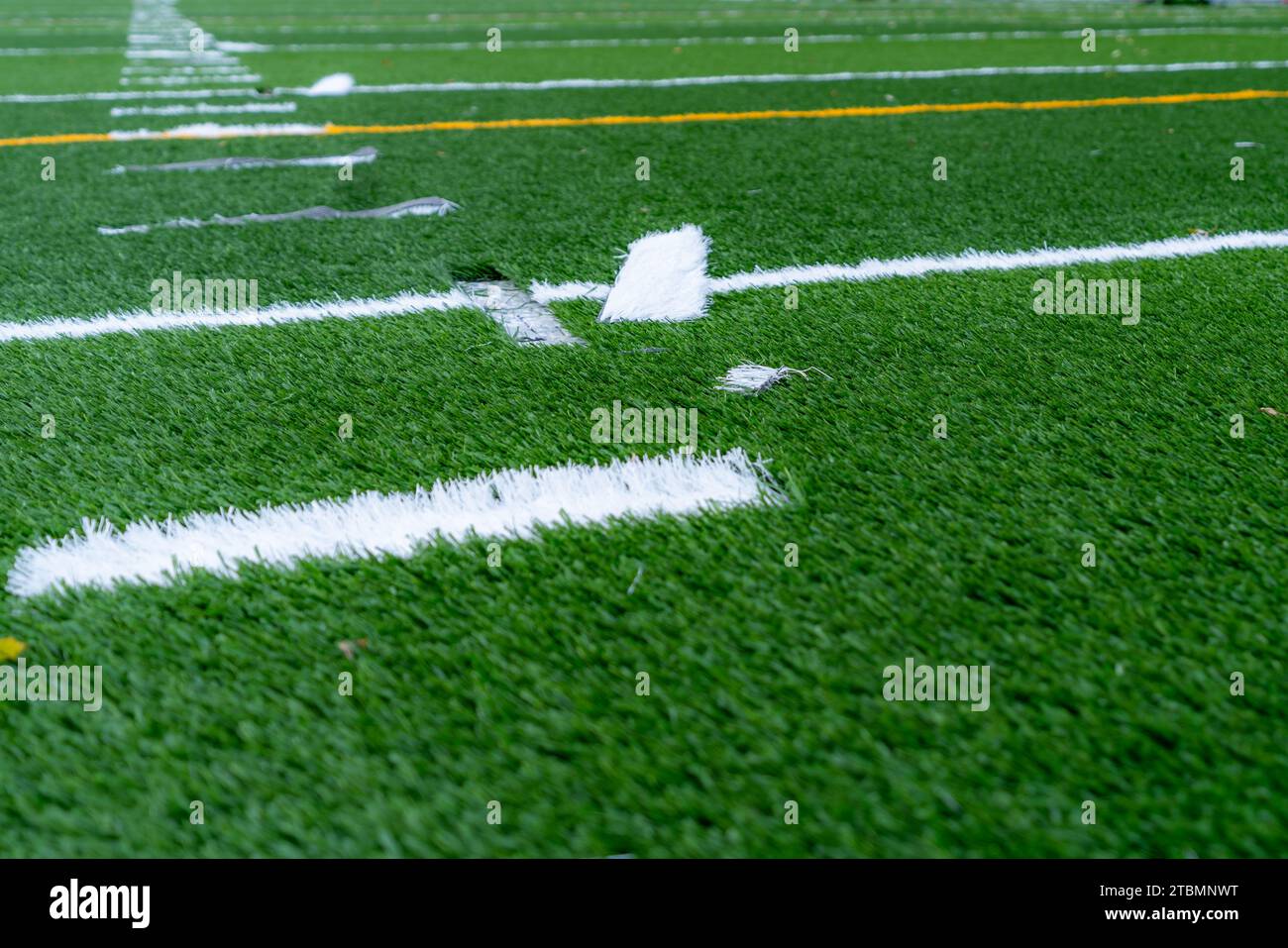 Synthetic turf field under construction with lines and graphics being ...