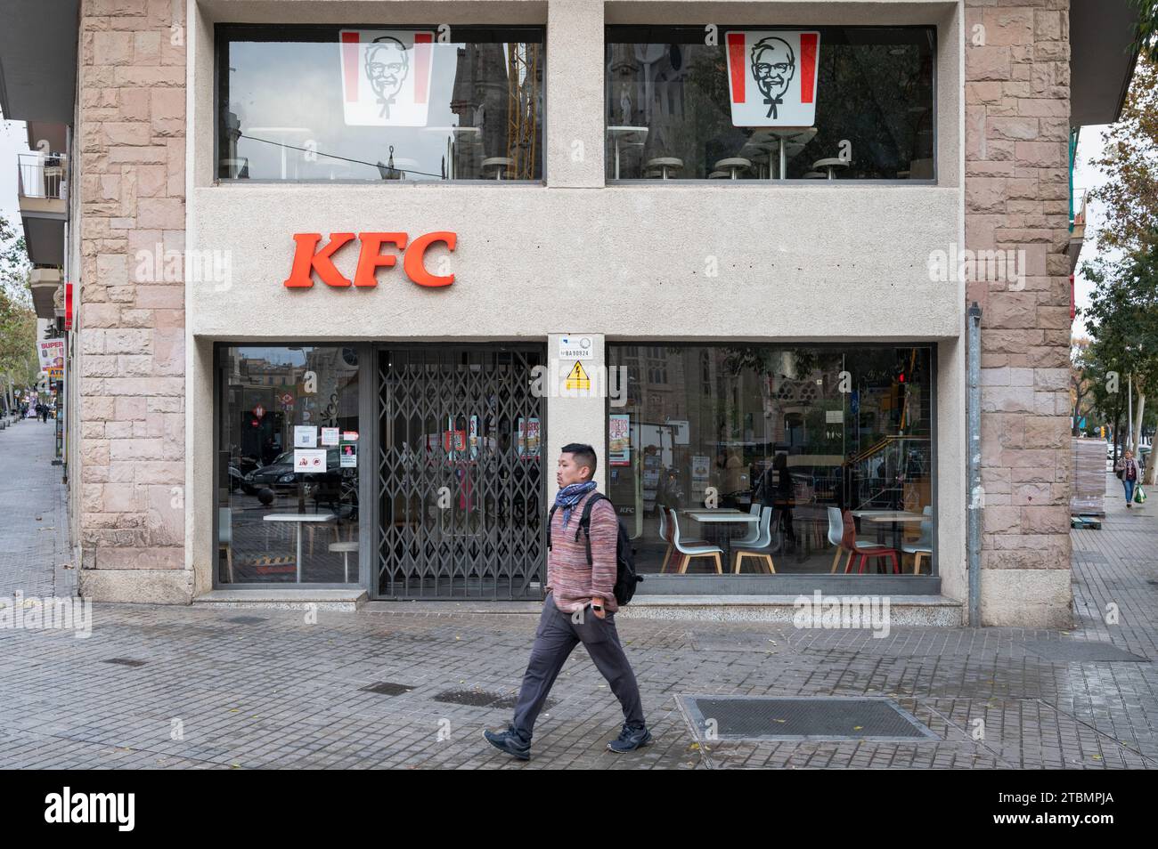 Barcelona, Spain. 21st Nov, 2023. A pedestrian walks past the American ...