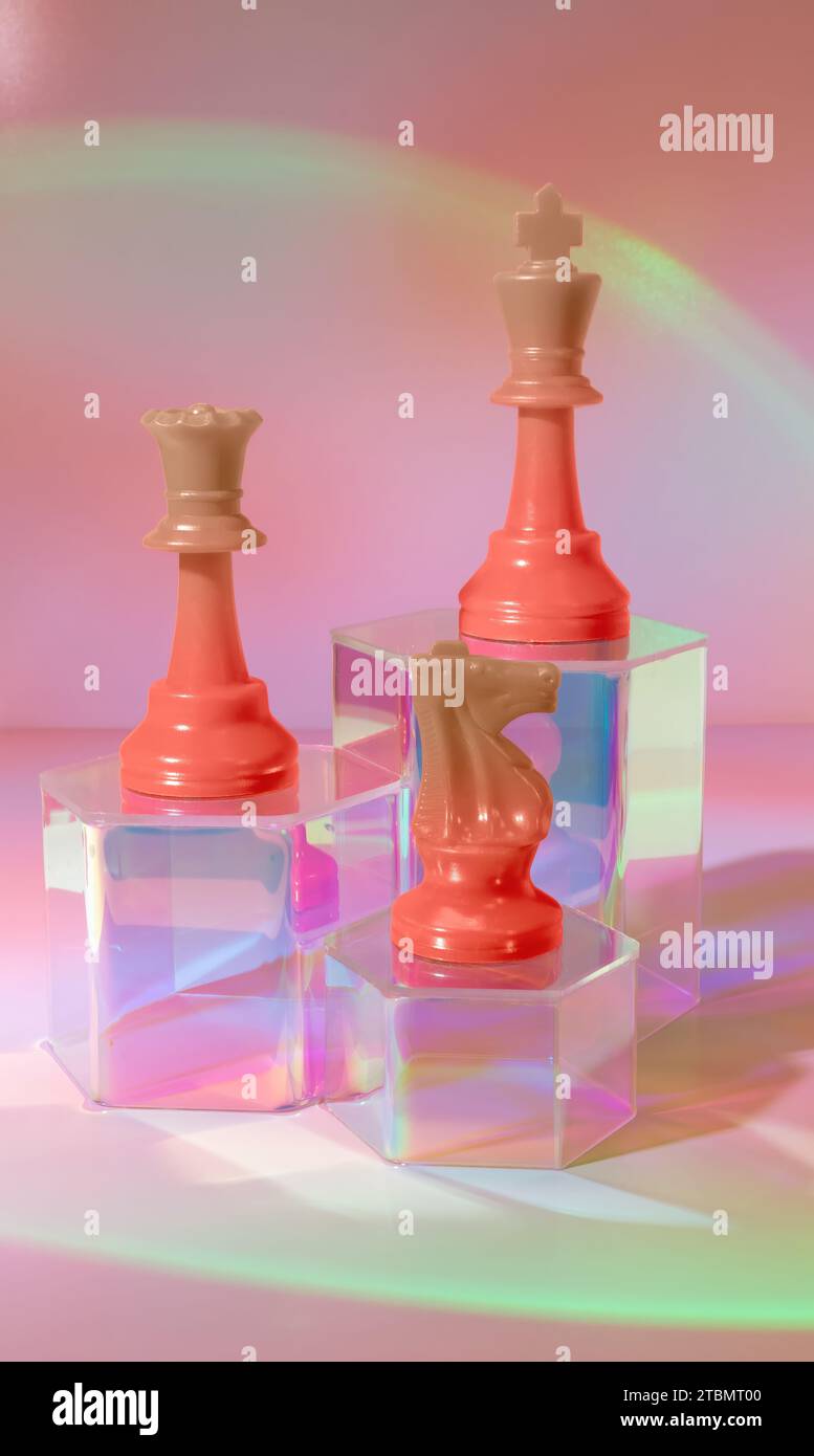 A Queen, King and Knight Chess Pieces in Gradient Orange Hues on ...