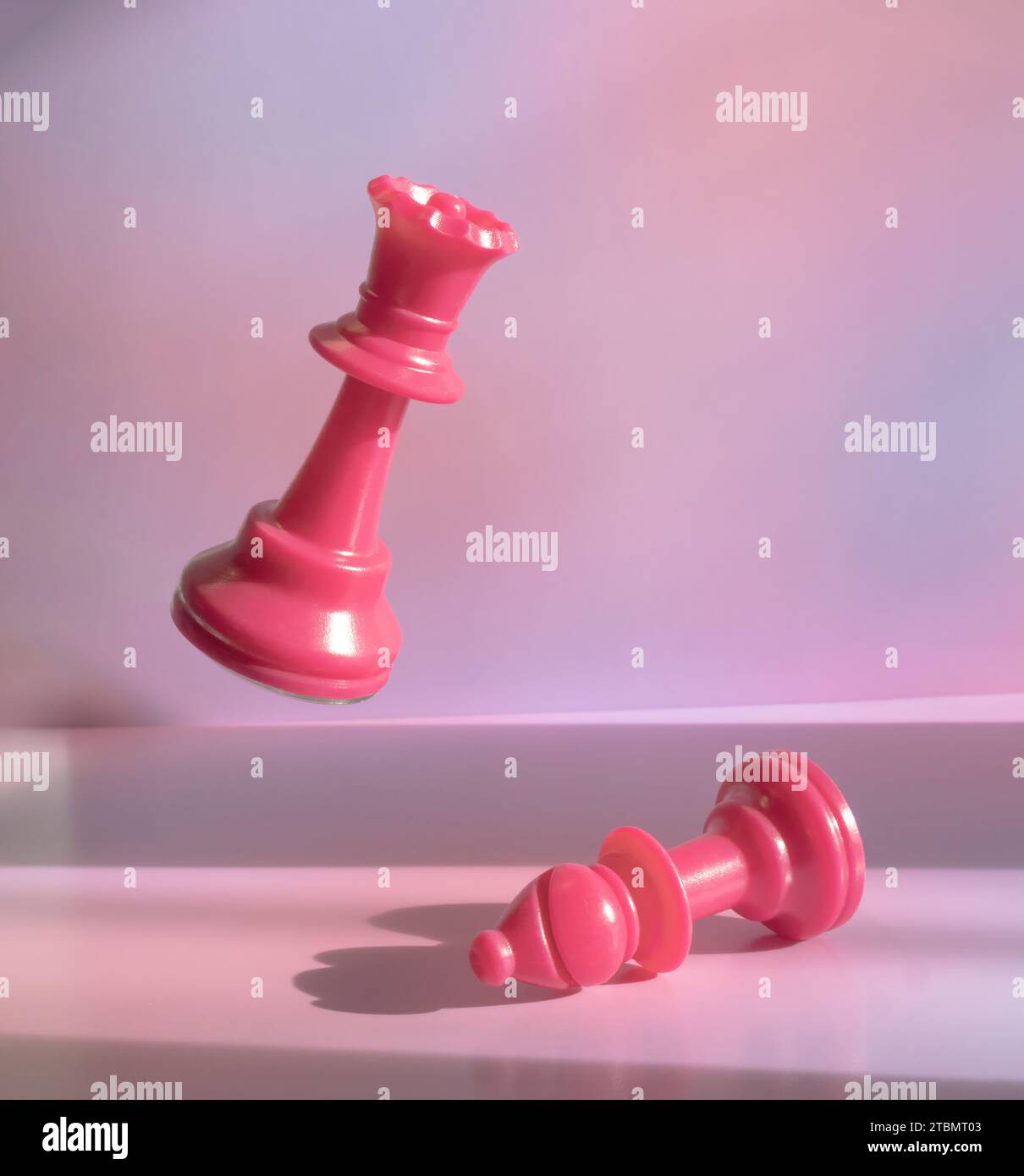 Pink Gradient Queen Chess Piece Floating Over Lying Down Bishop Chess ...