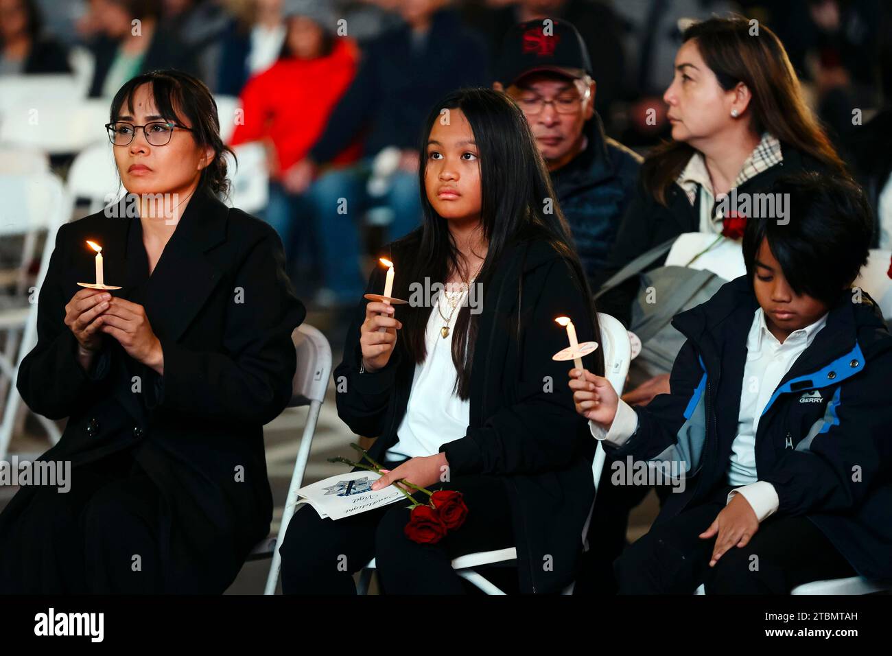 People gather at Allegiant Stadium for a vigil for fallen Nevada State ...