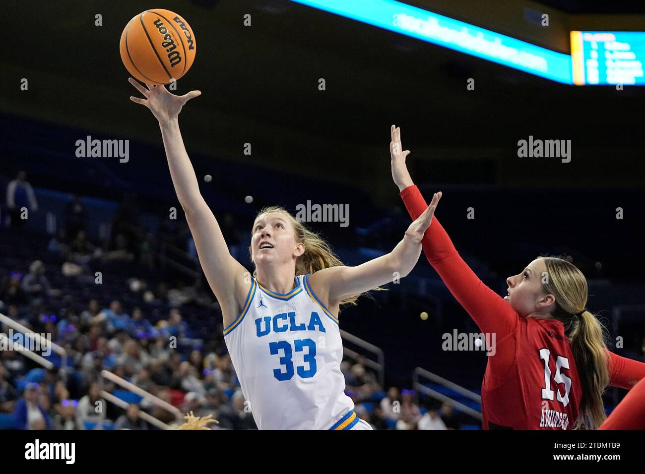 UCLA forward Amanda Muse, left, shoots as Cal State Northridge forward ...