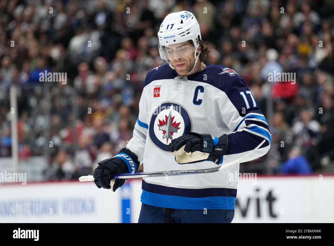 Winnipeg Jets center Adam Lowry waits for play to resume during the ...